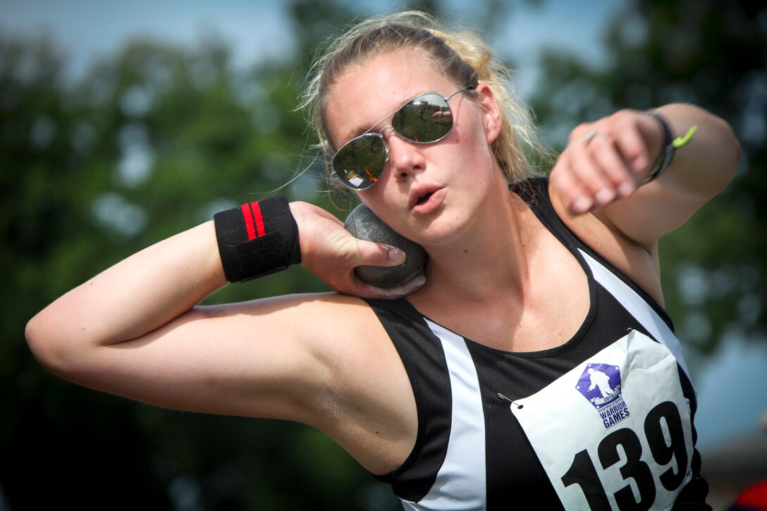 A U.S. Army athlete competes in the shot put event at the 2015 ...
