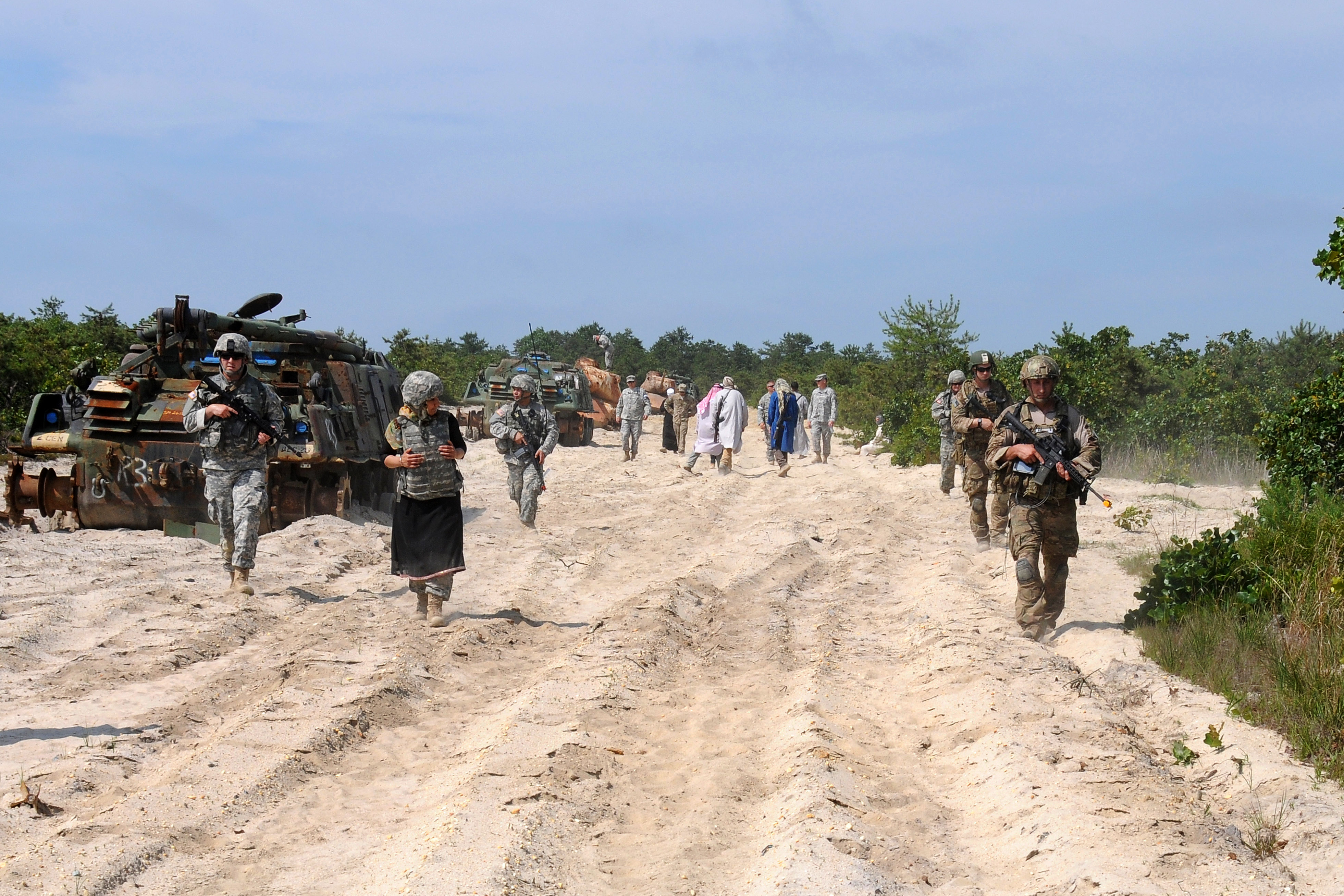 Soldiers and airmen patrol a simulated city during Operation Morning ...