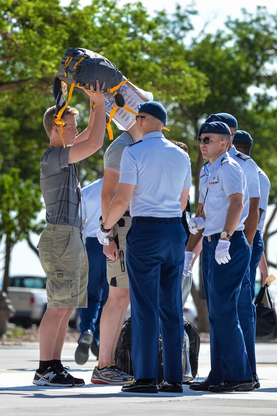 Basic training cadet cadre members instruct a cadet at the U.S. Air ...