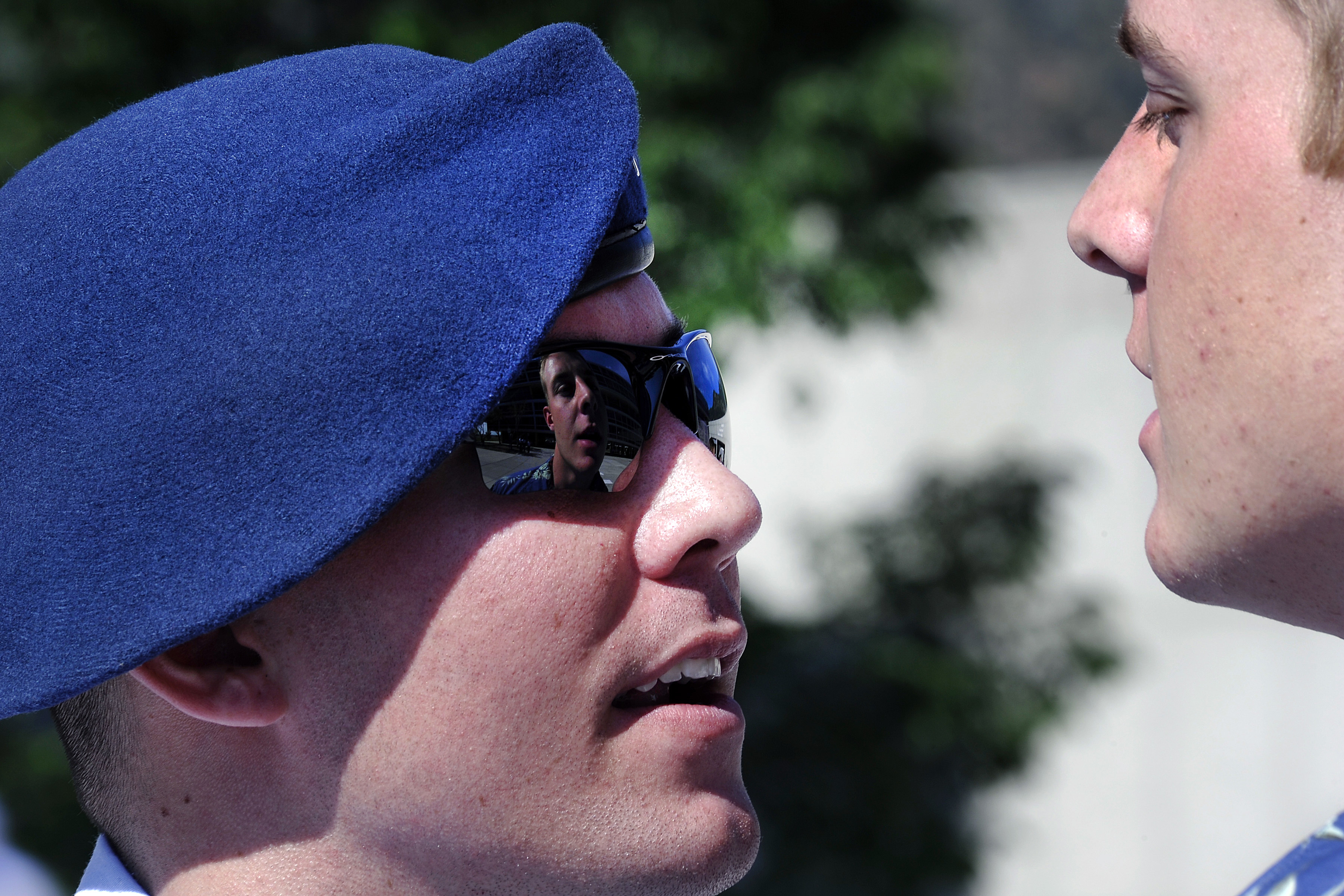 A basic training cadet cadre member directs a cadet at the U.S. Air ...