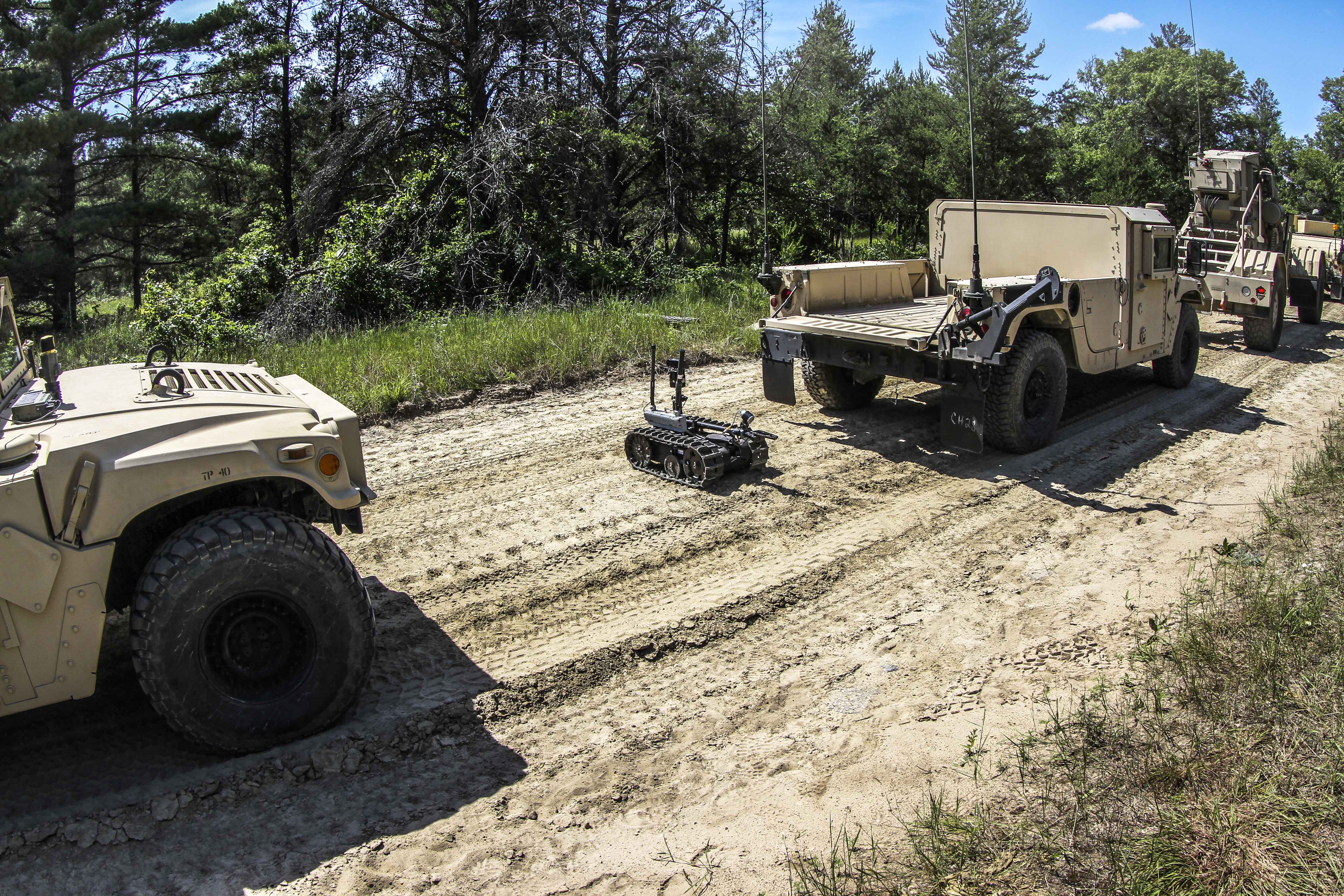 Army reservists use the Talon tracked military robot during a route ...
