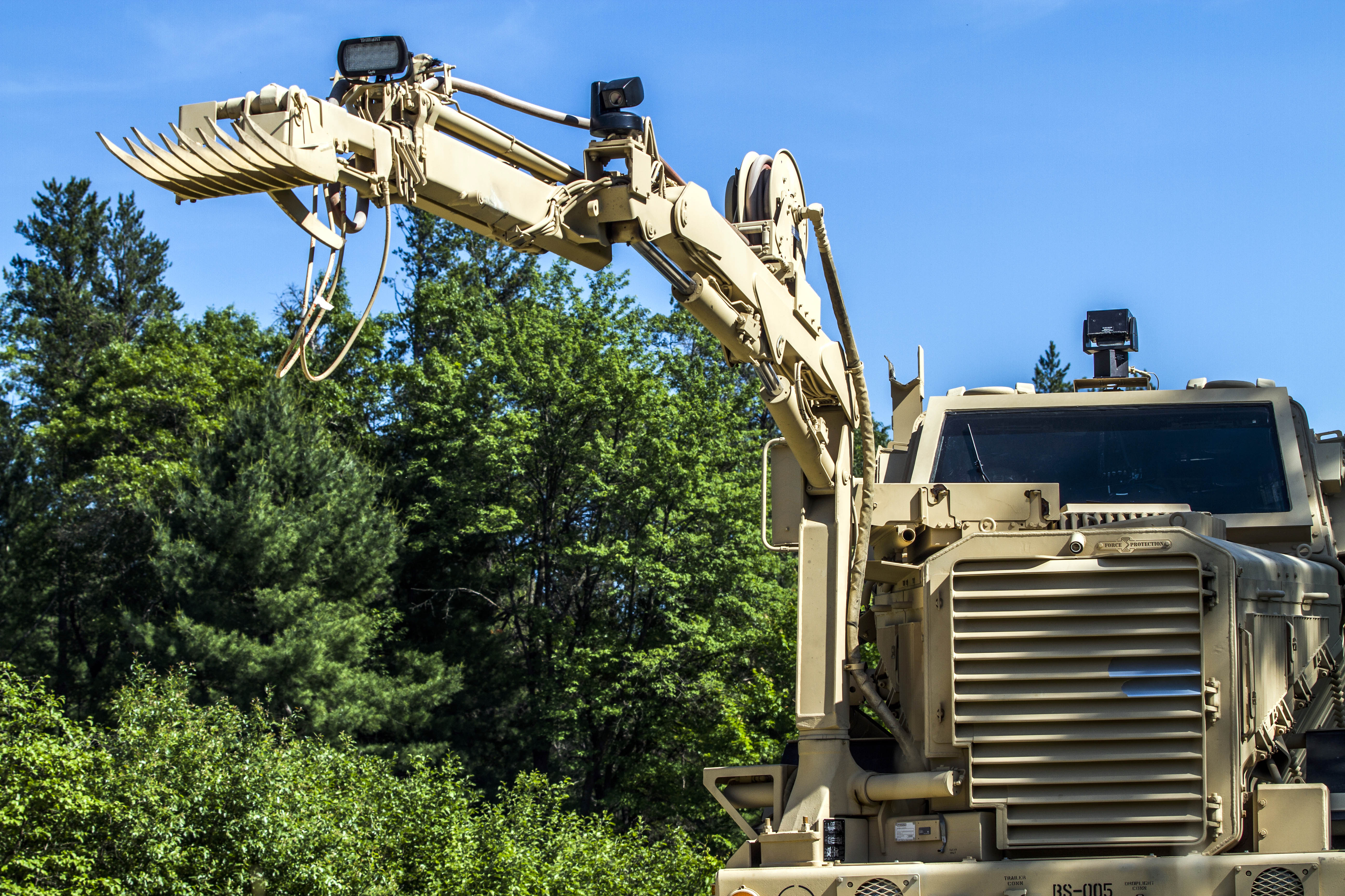 Army reservists use a Buffalo mine-resistant, ambush-protected vehicle ...