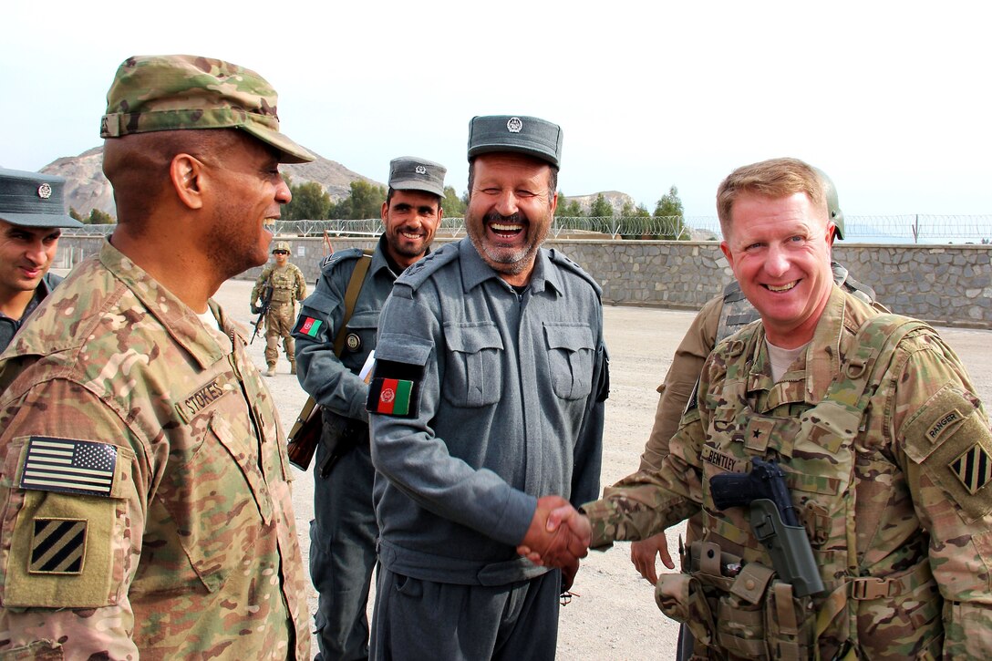 The commander of the regional police logistics center shakes hands with ...