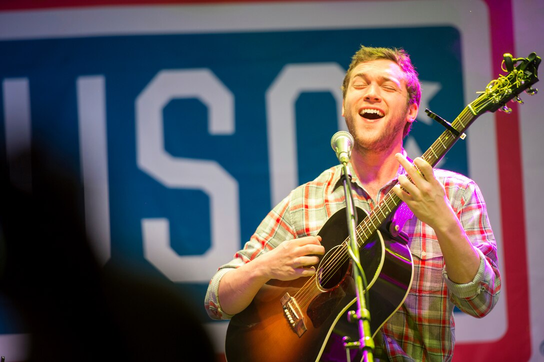 Musician Phillip Phillips performs for U.S. service members during a ...