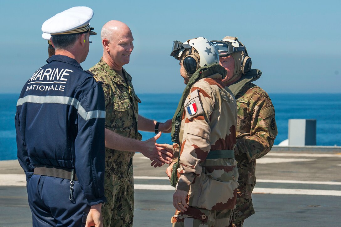 U.S. Navy Rear Adm. Christopher Grady, left, commander of Carrier ...