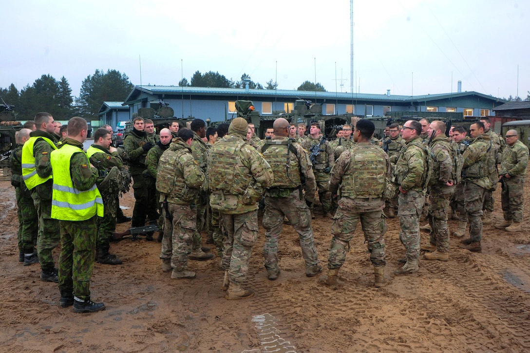 U.S. and Lithuanian soldiers conduct an after action review following ...