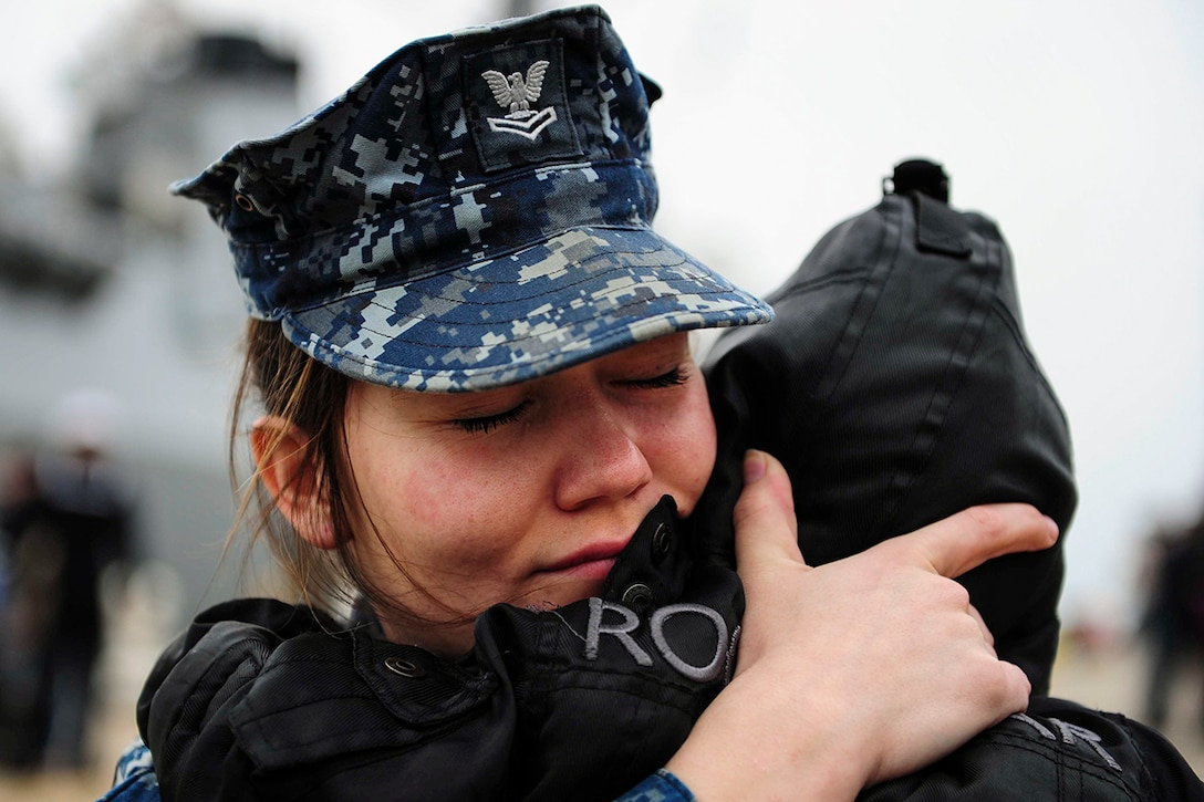 Navy Petty Officer 2nd Class Ashley Urias says farewell to her family ...