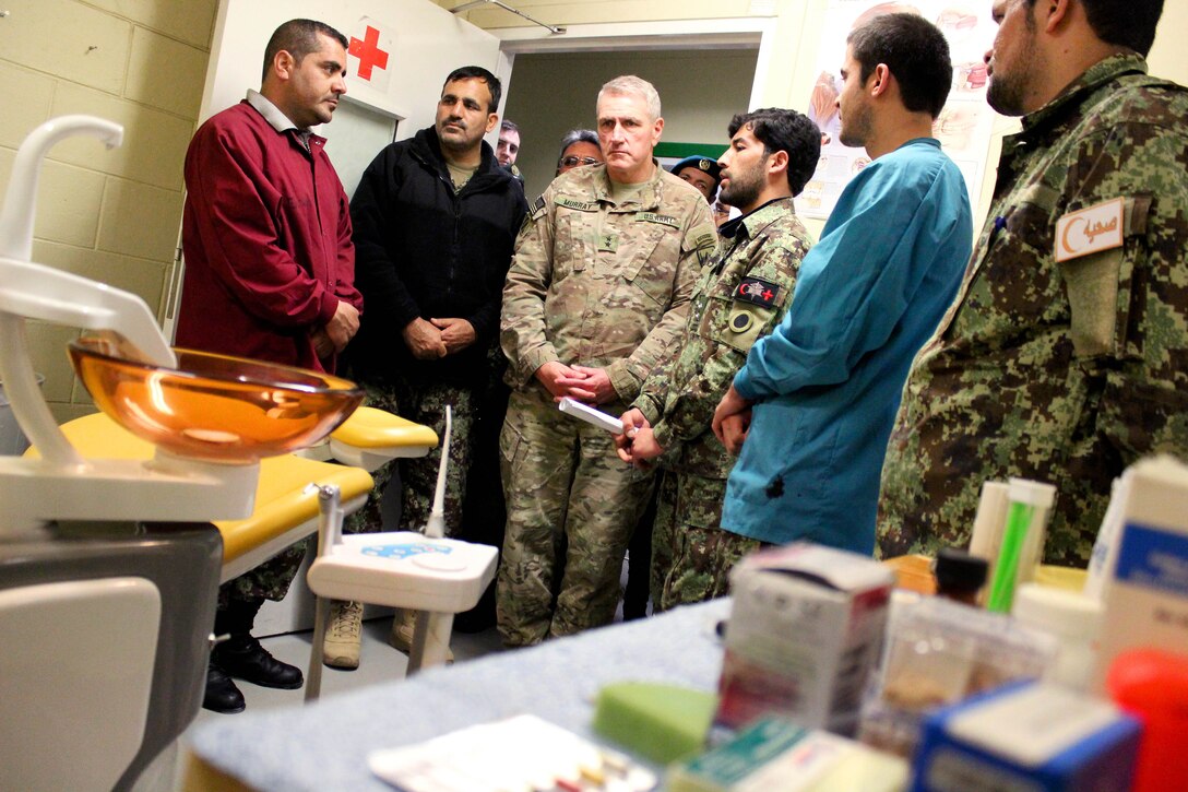 U.S. Army Maj. Gen. Mike Murray, center, deputy commander, U.S. Forces ...