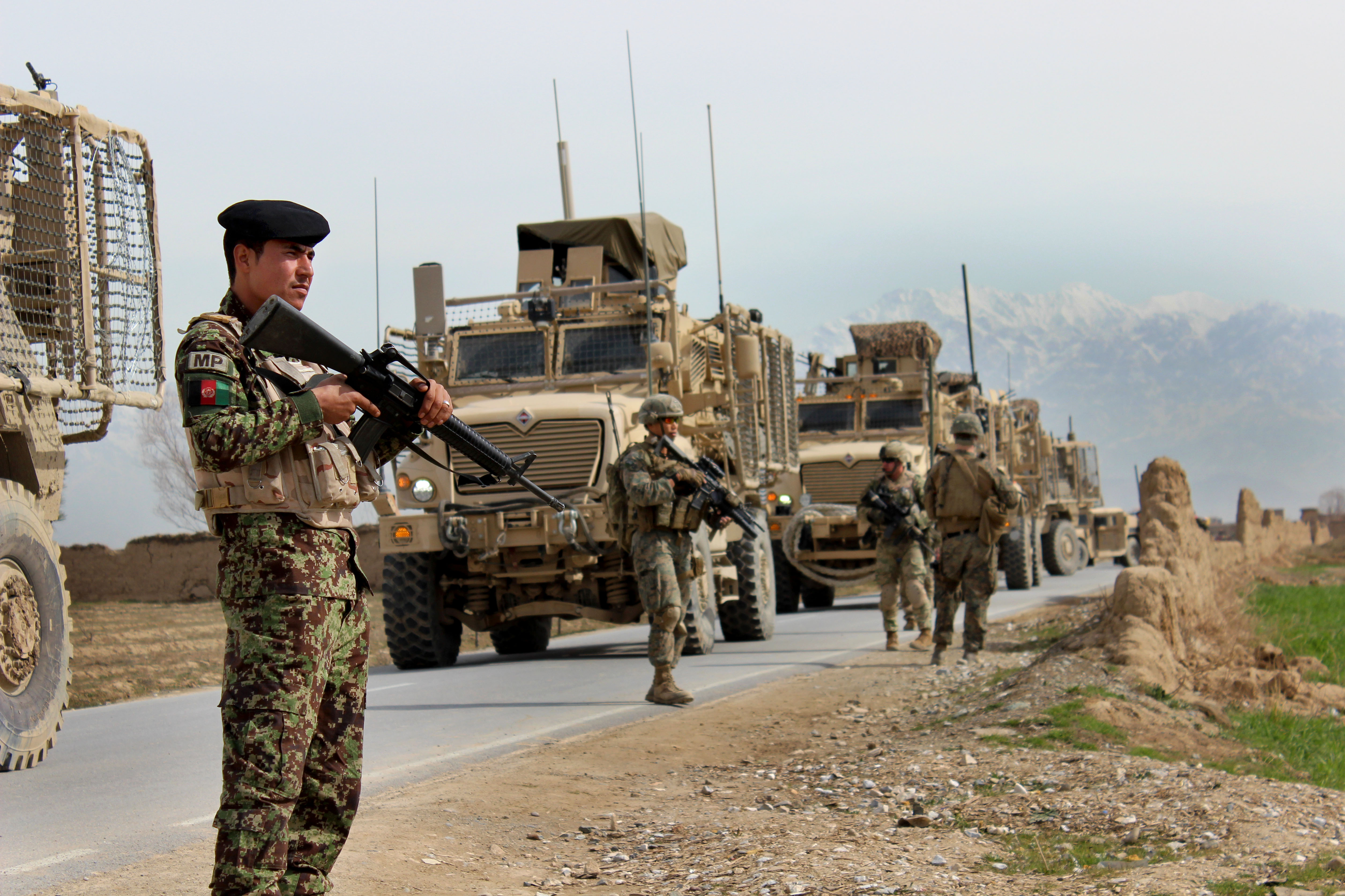 U.S. Marines and U.S., Afghan and Georgian soldiers prepare to patrol ...