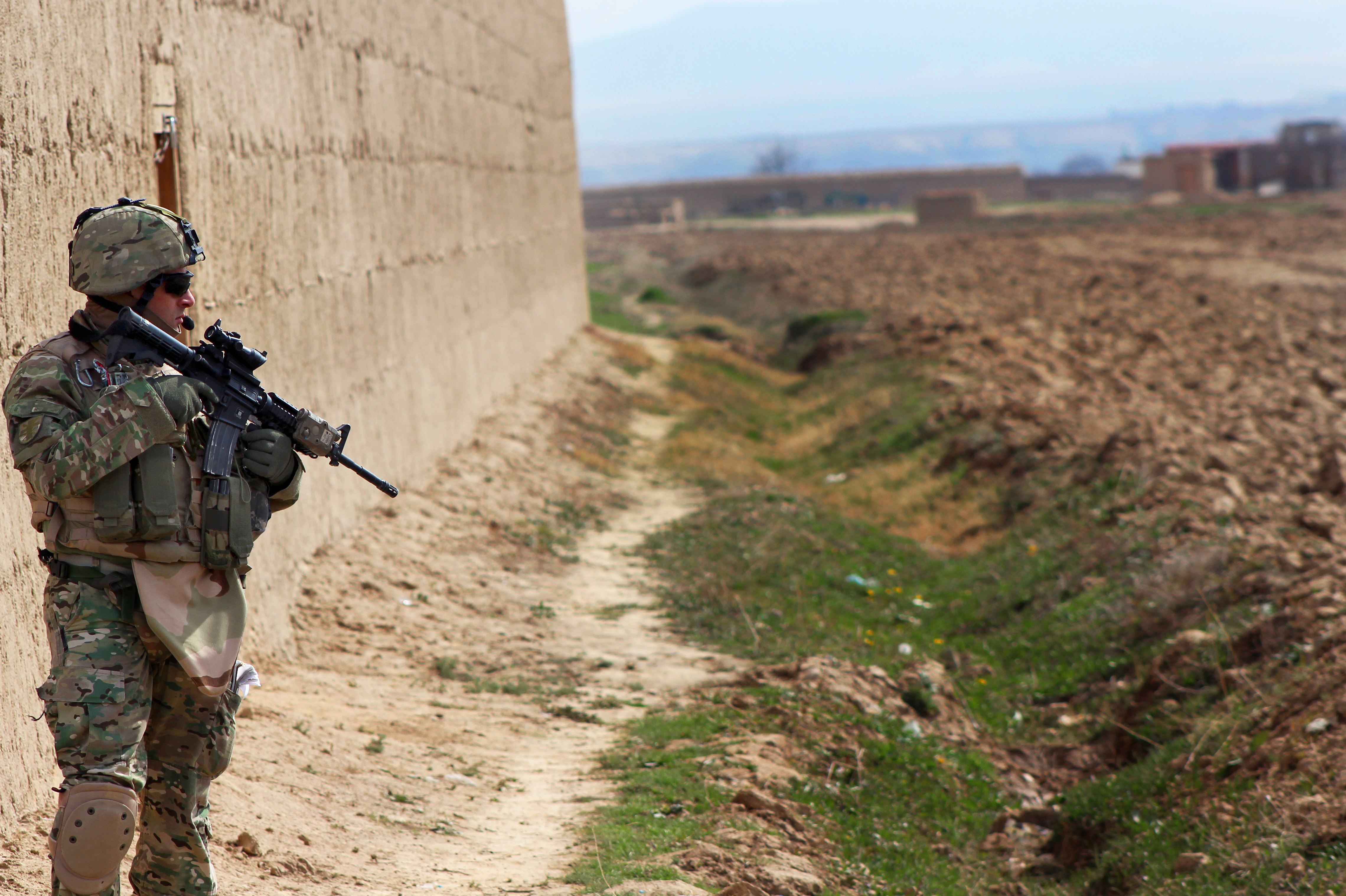 A Georgian soldier provides security during a patrol outside of the ...