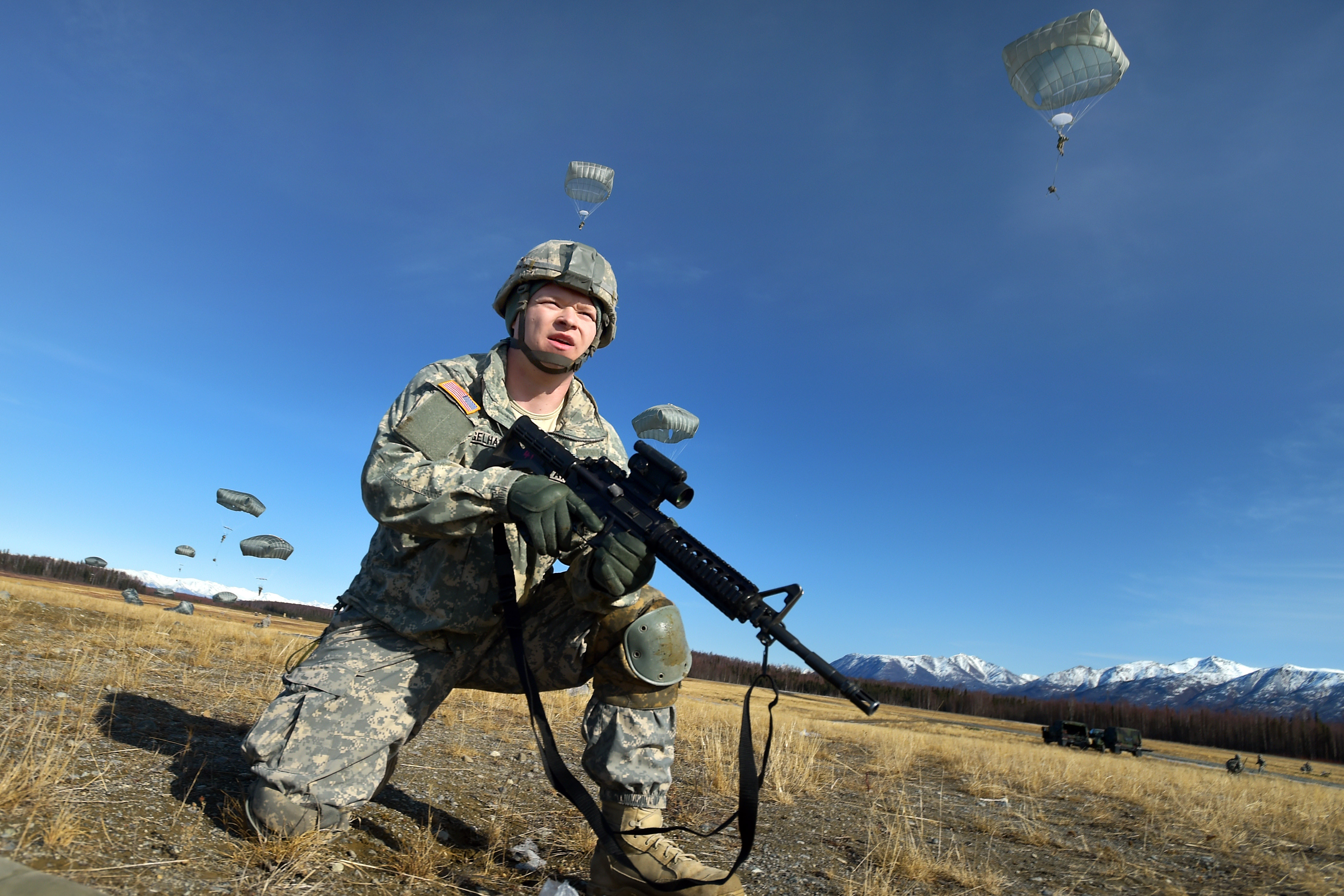 Army Staff Sgt. Cody Engelhardt provides security as paratroopers ...