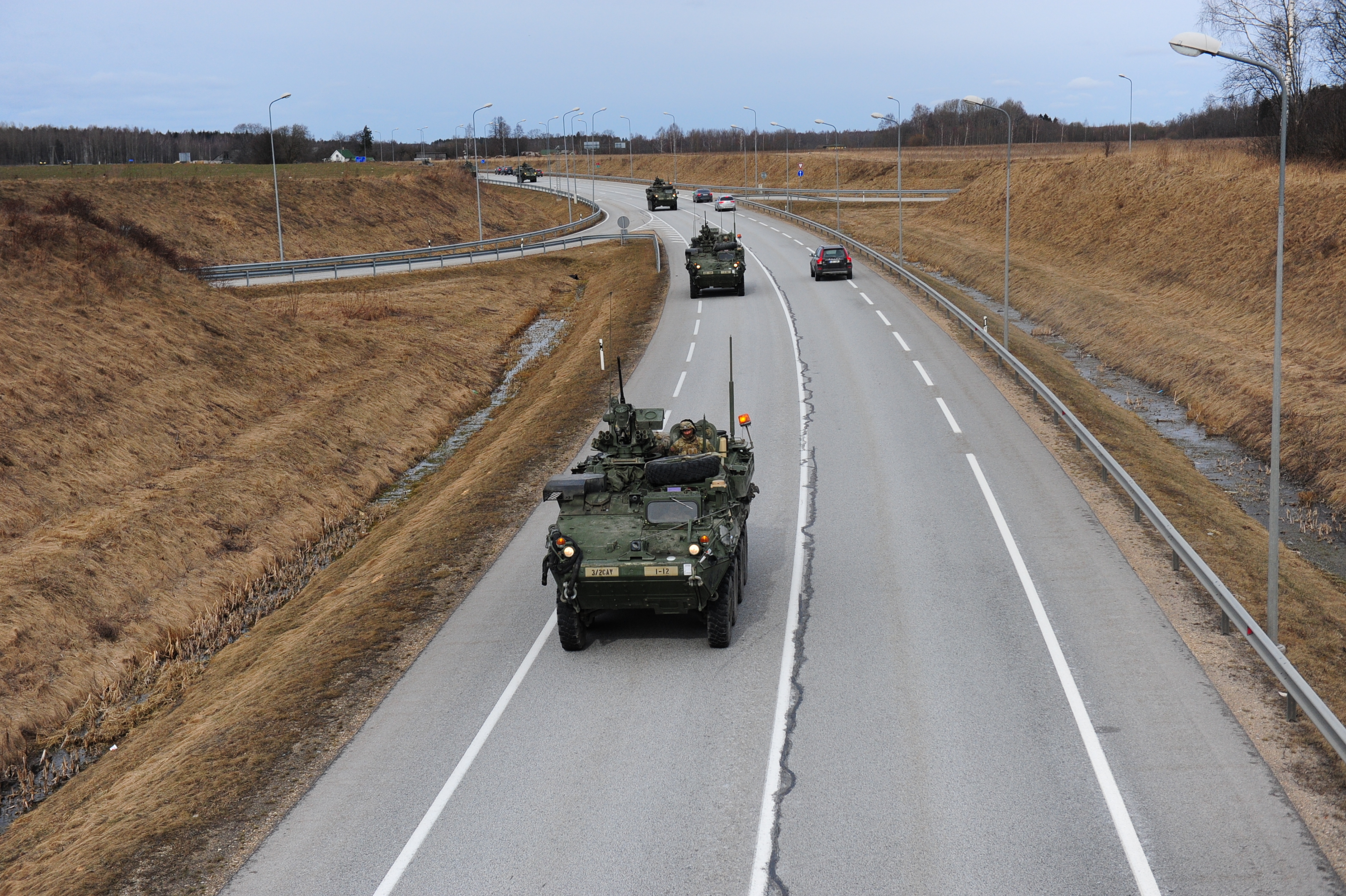 Stryker armored vehicles travel down the E67 highway on day two of ...