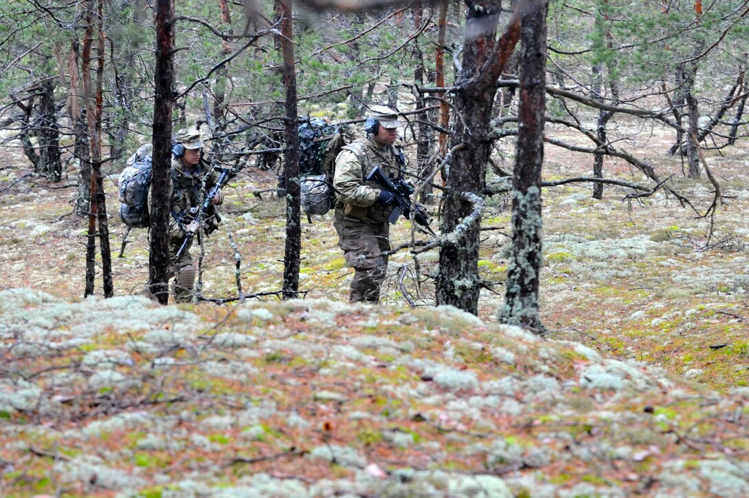 U.S. soldiers participate in a patrol after conducting a water ...