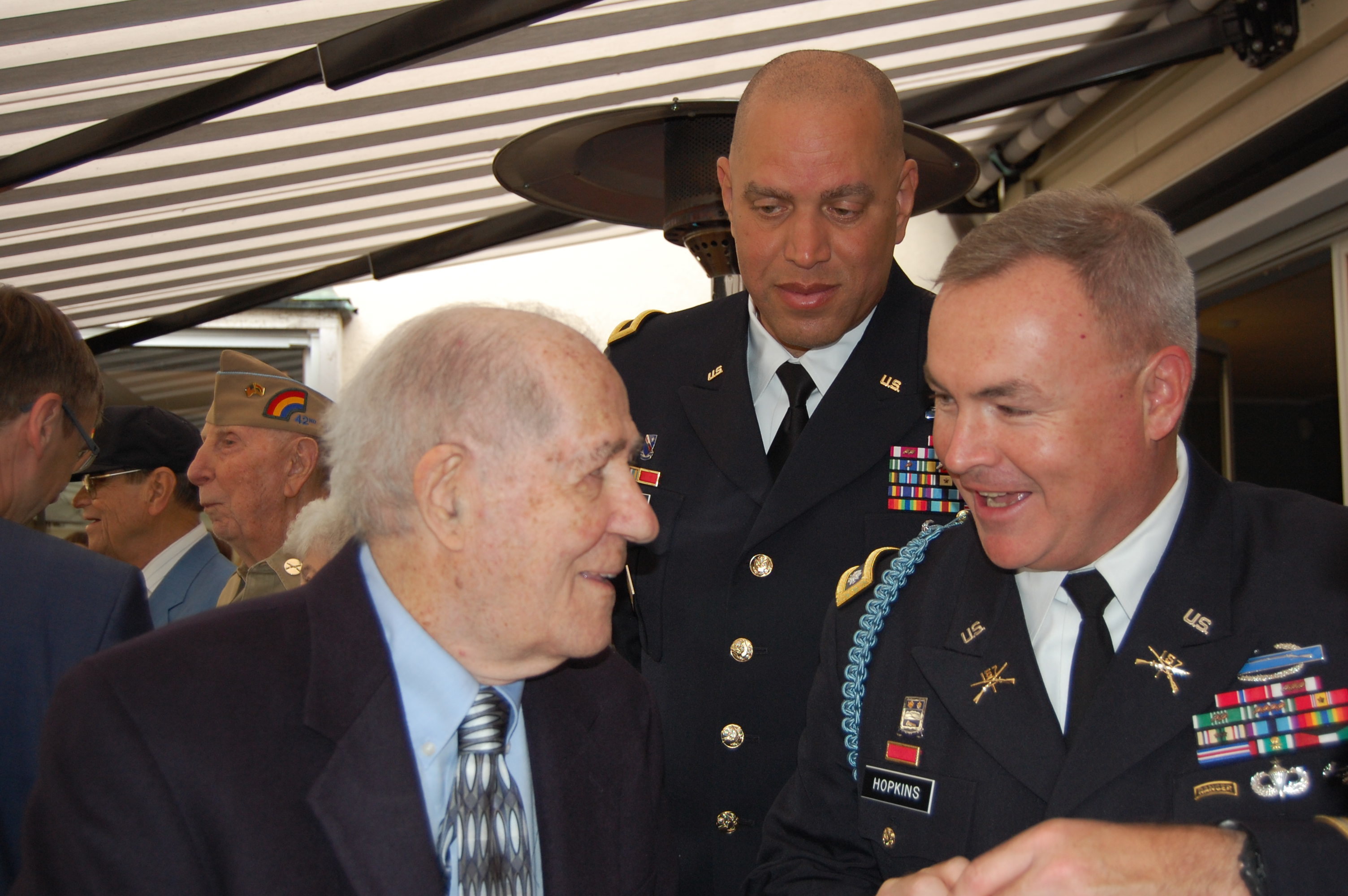 U.S. Army Brig. Gen. Michael C. Thompson, center, the assistant ...
