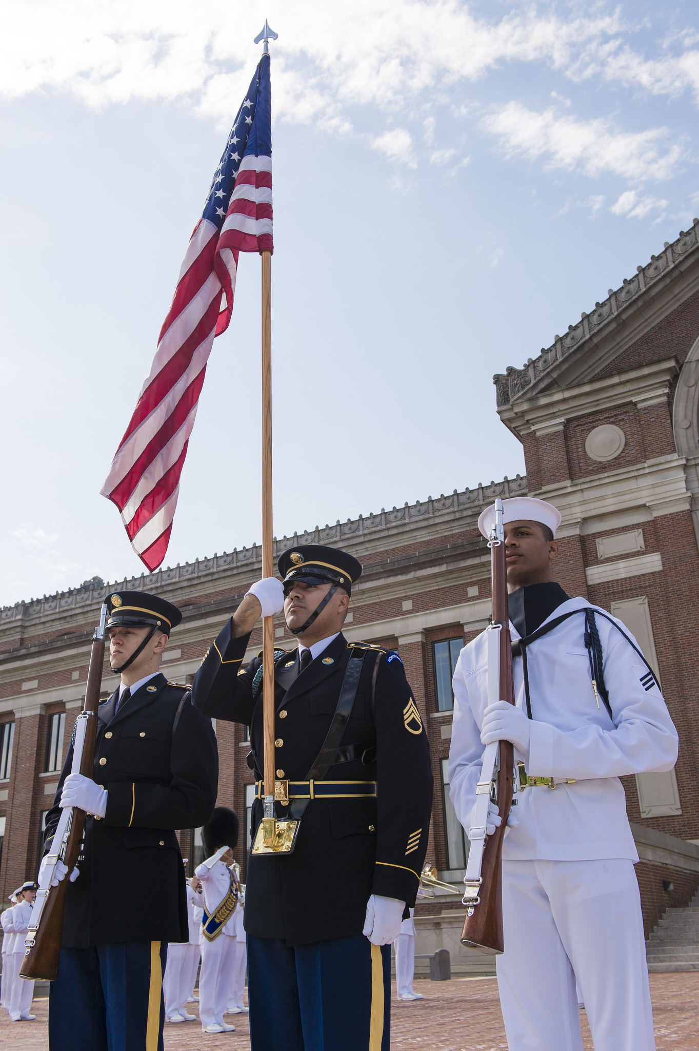 U.S. military joint color guard troops stand in formation during the ...