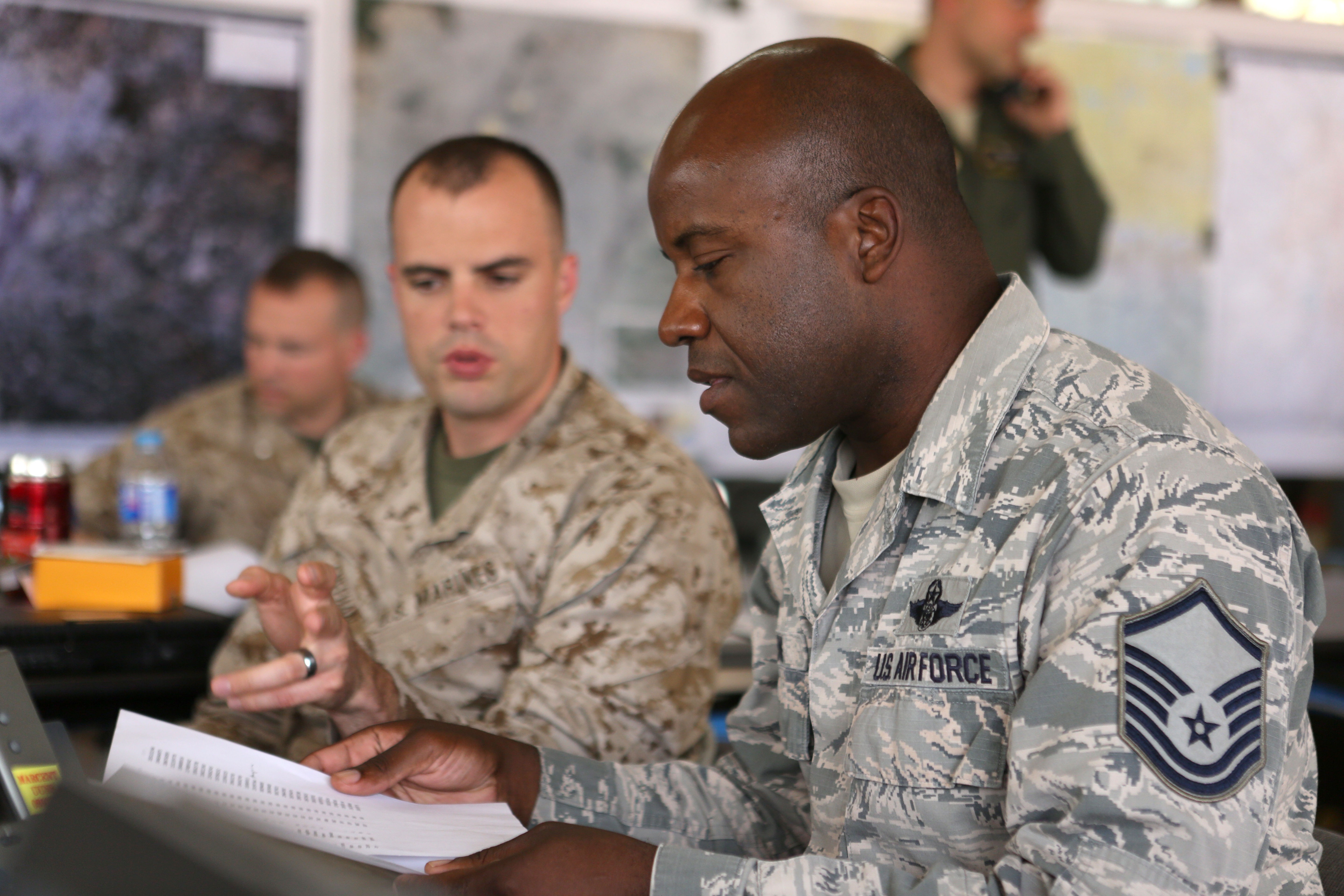 U.S. Marine Corps Capt. James Sheehan, left, and Air Force Master Sgt ...