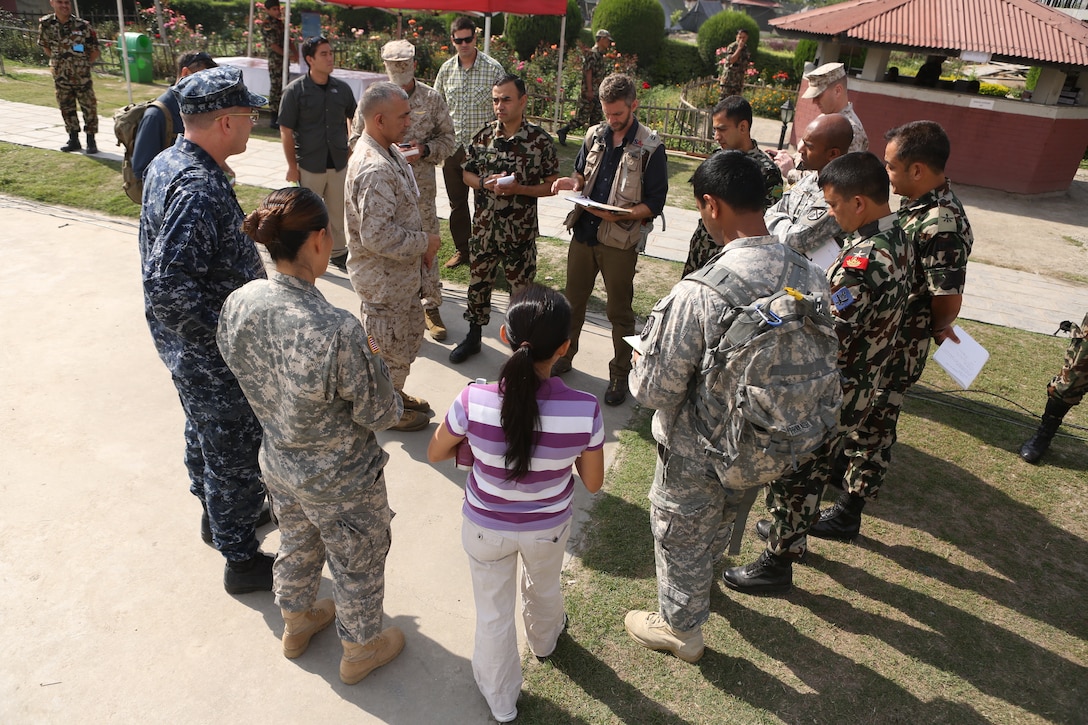 U.S. and Nepalese service members coordinate efforts after the Multi ...