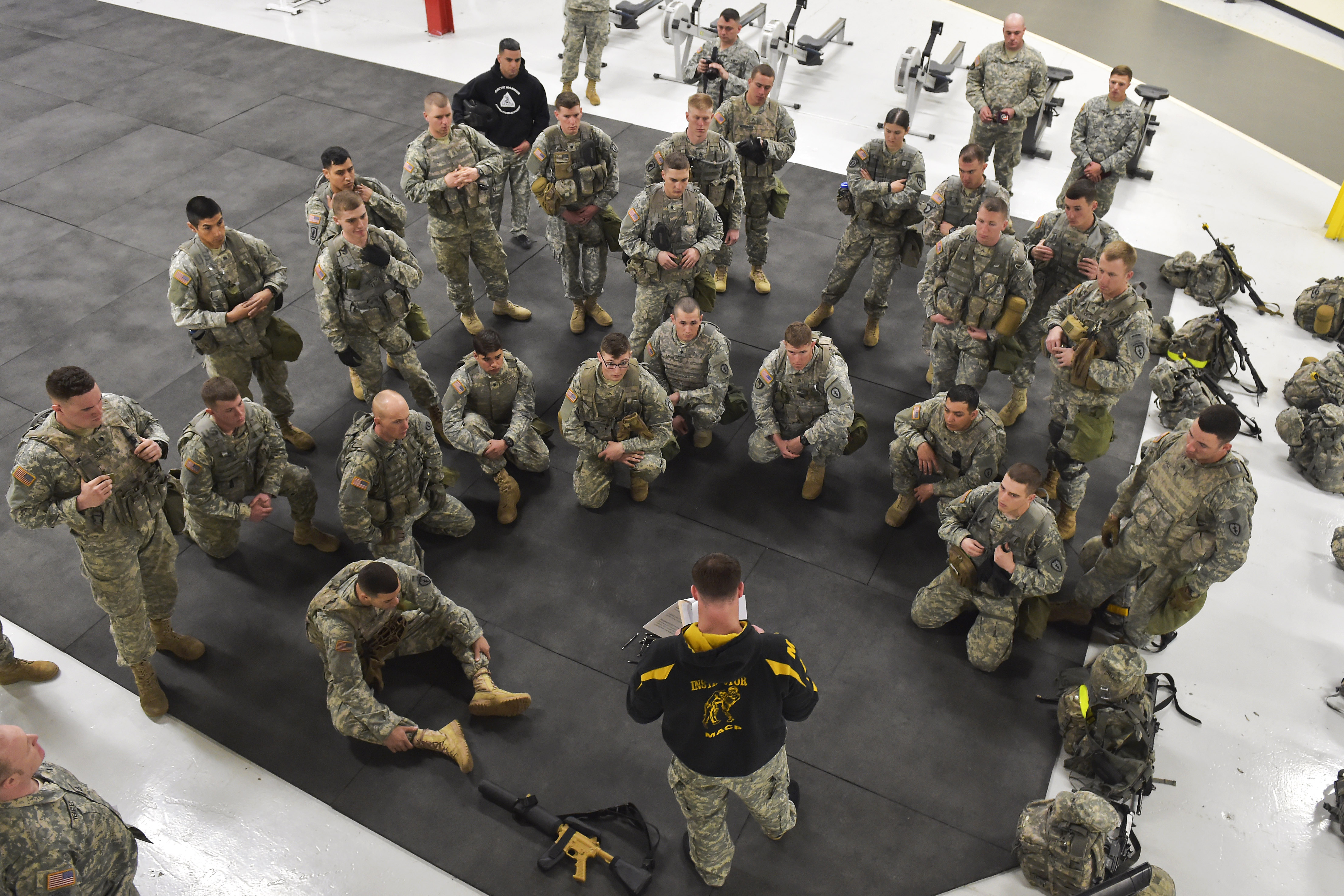 Soldiers are briefed before a combined obstacle course and combatives ...