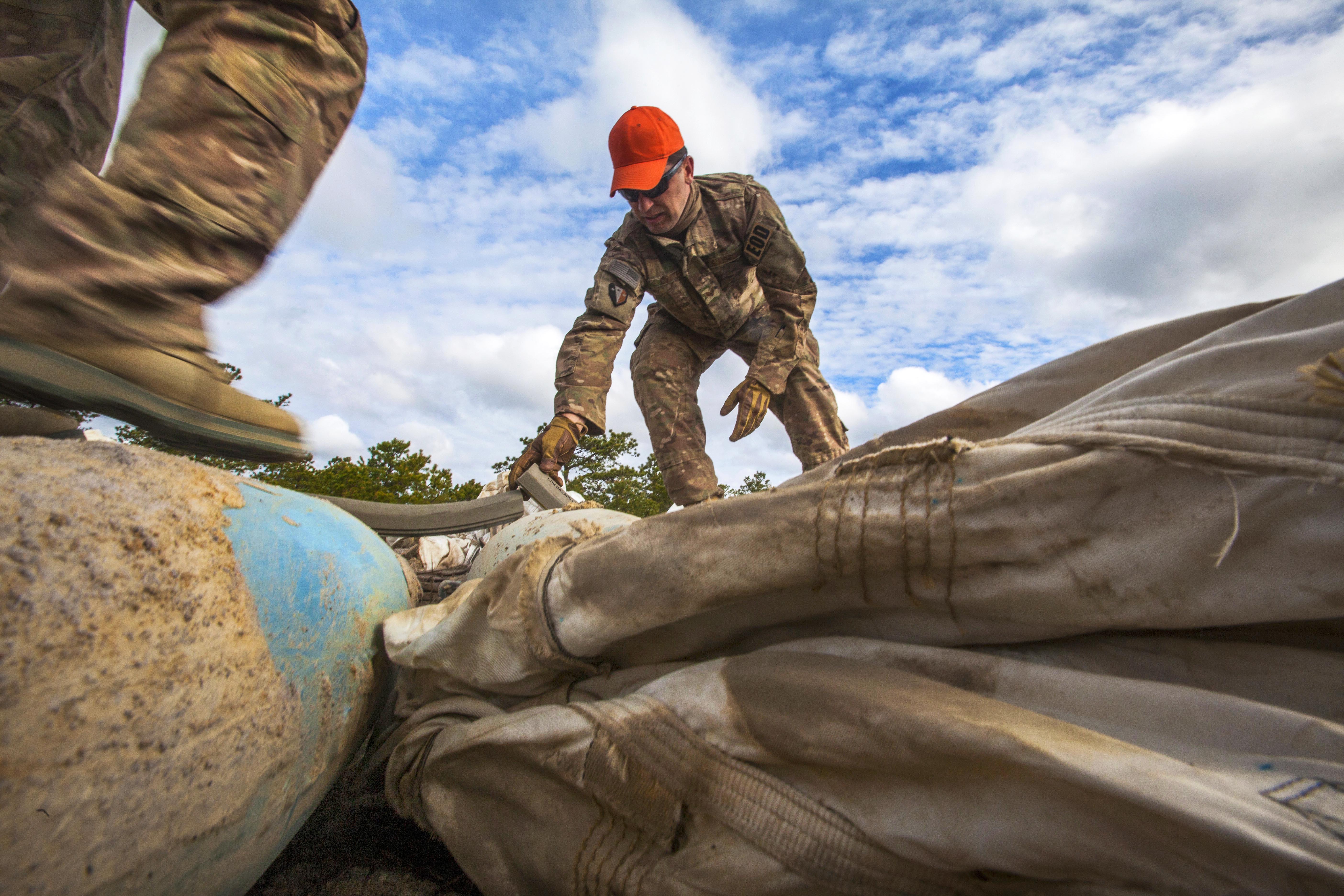 New Jersey Air National Guard Staff Sgt. Joe Coates, right, joins two ...