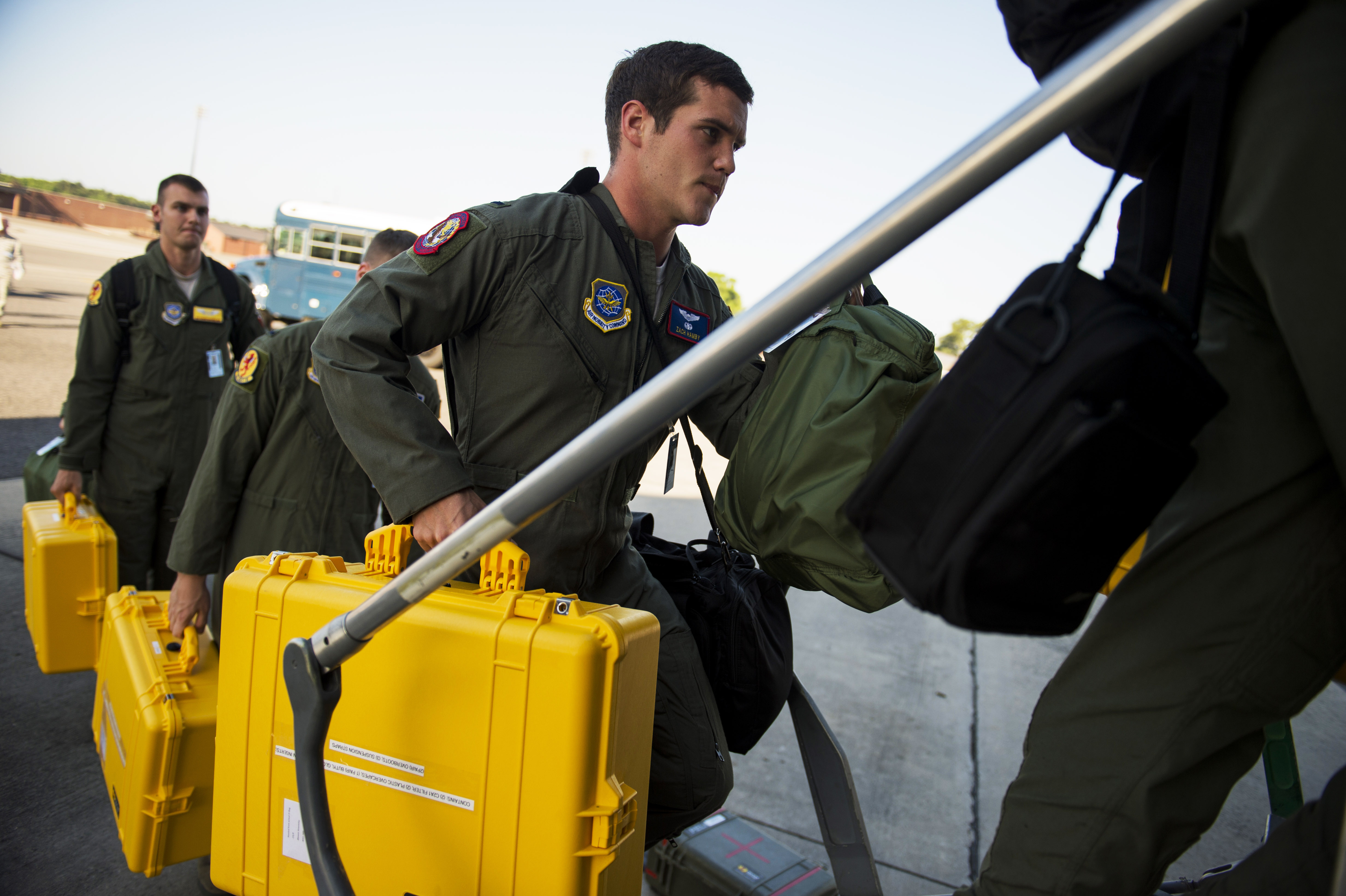 U.S. Air Force 1st Lt. Zachary Hamby, front, boards a C-17 Globemaster ...