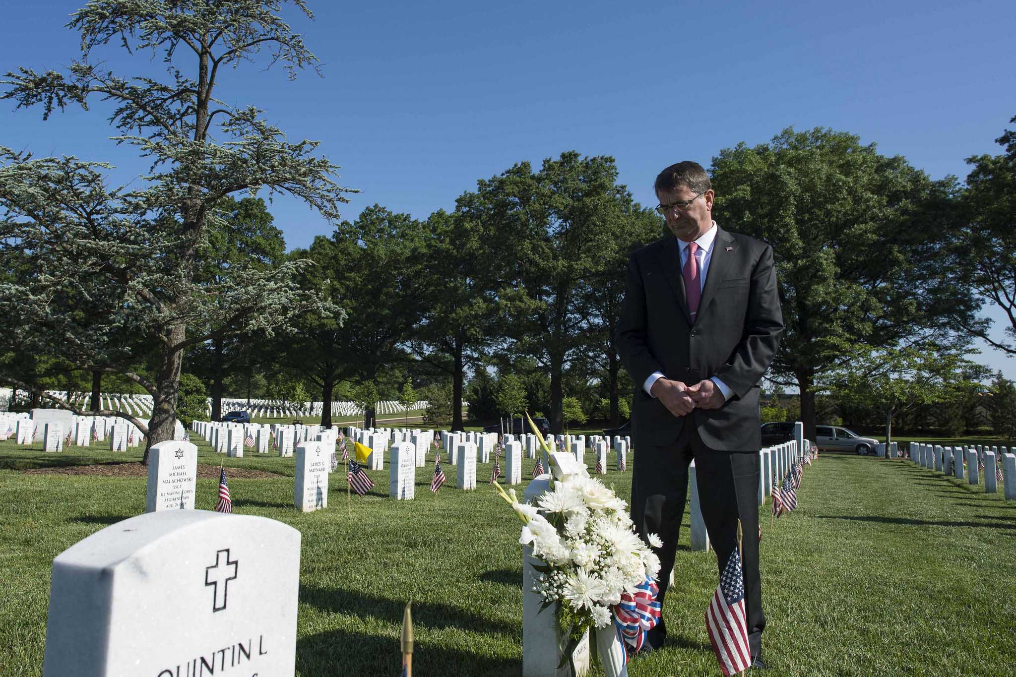 Defense Secretary Ash Carter visits the gravesite of Army Spc ...