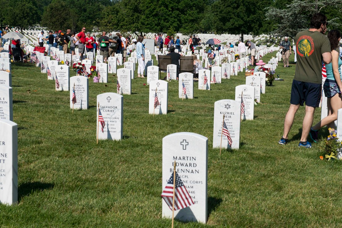 Memorial Day visitors spend time at the gravesites of their loved ones ...