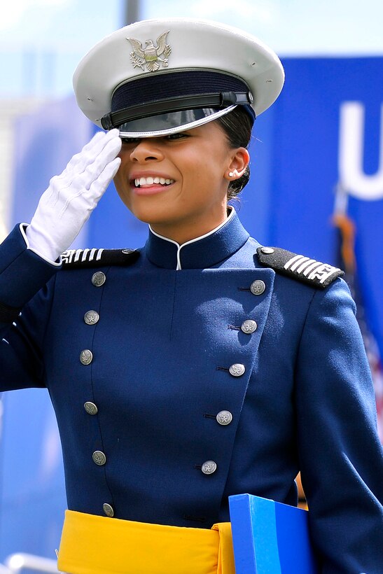 Cadet Kayla Vildosola salutes a classmate after receiving her diploma ...