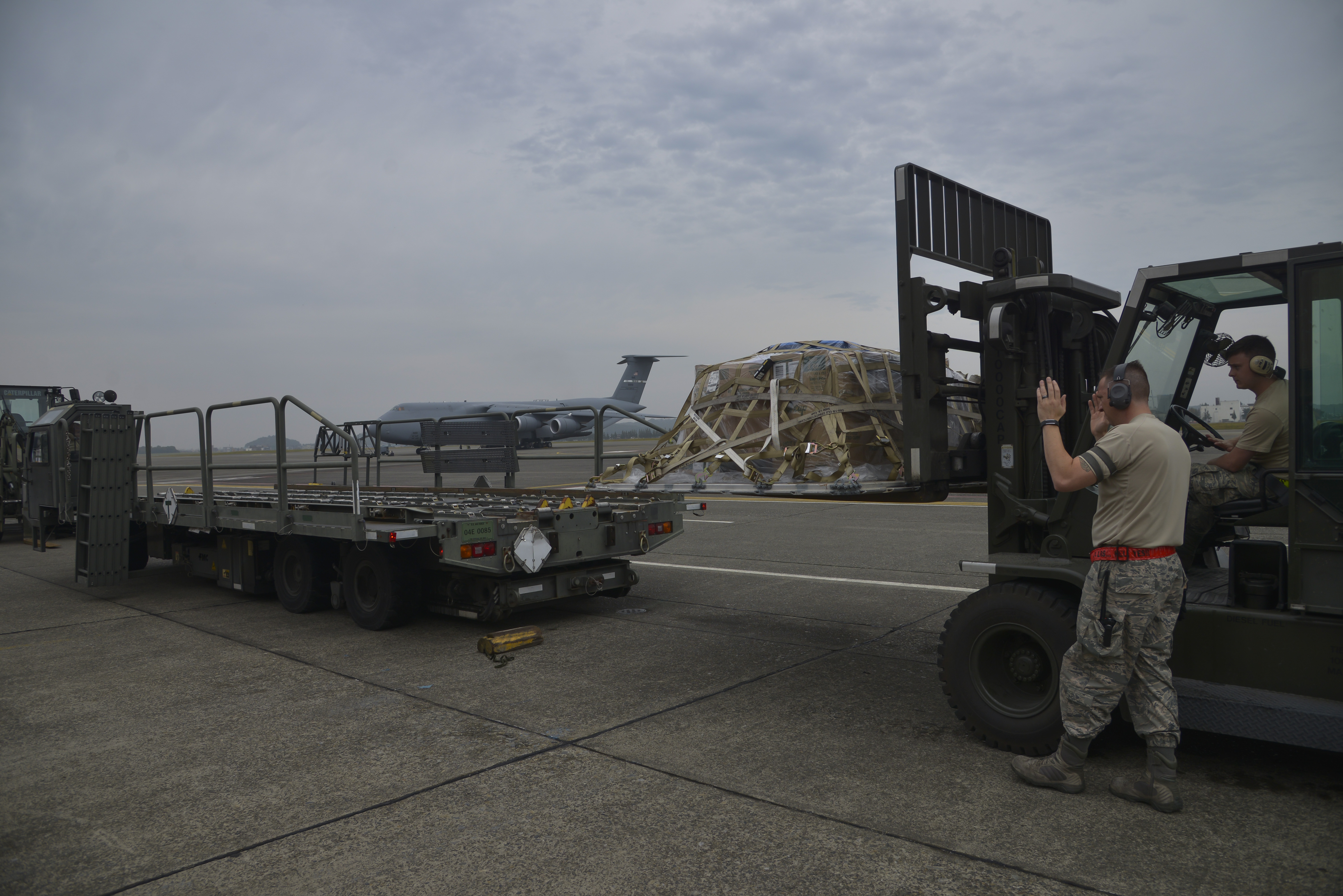 LRS Airmen load cargo
