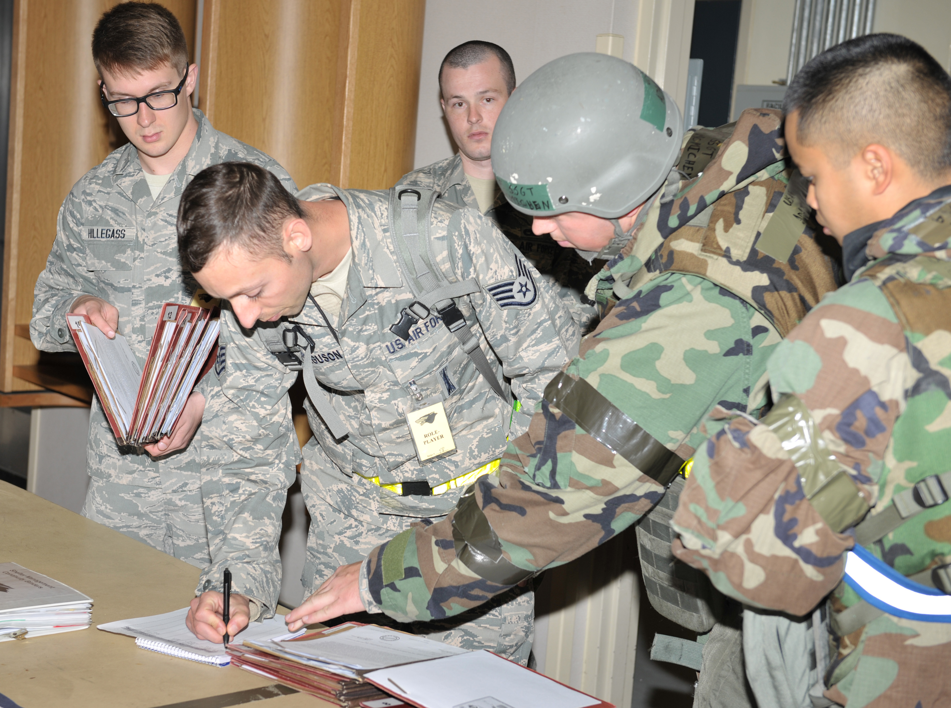 Personnel from the 8th Force Support Squadron in-process new Airmen.