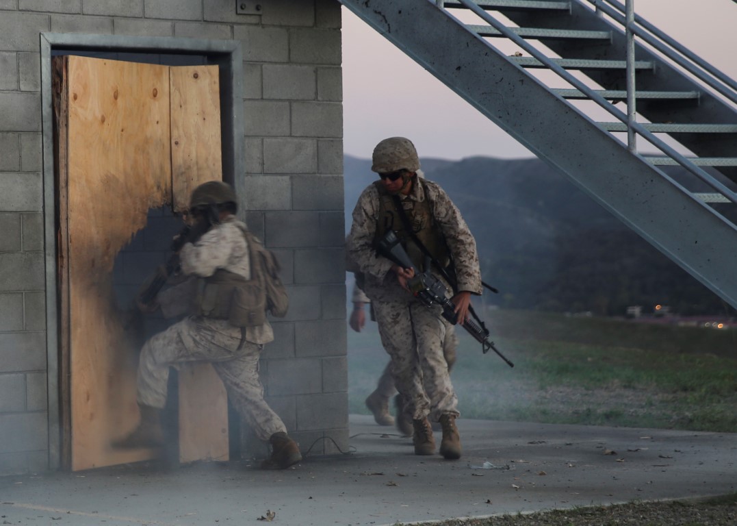 Marines blow the door off its hinges