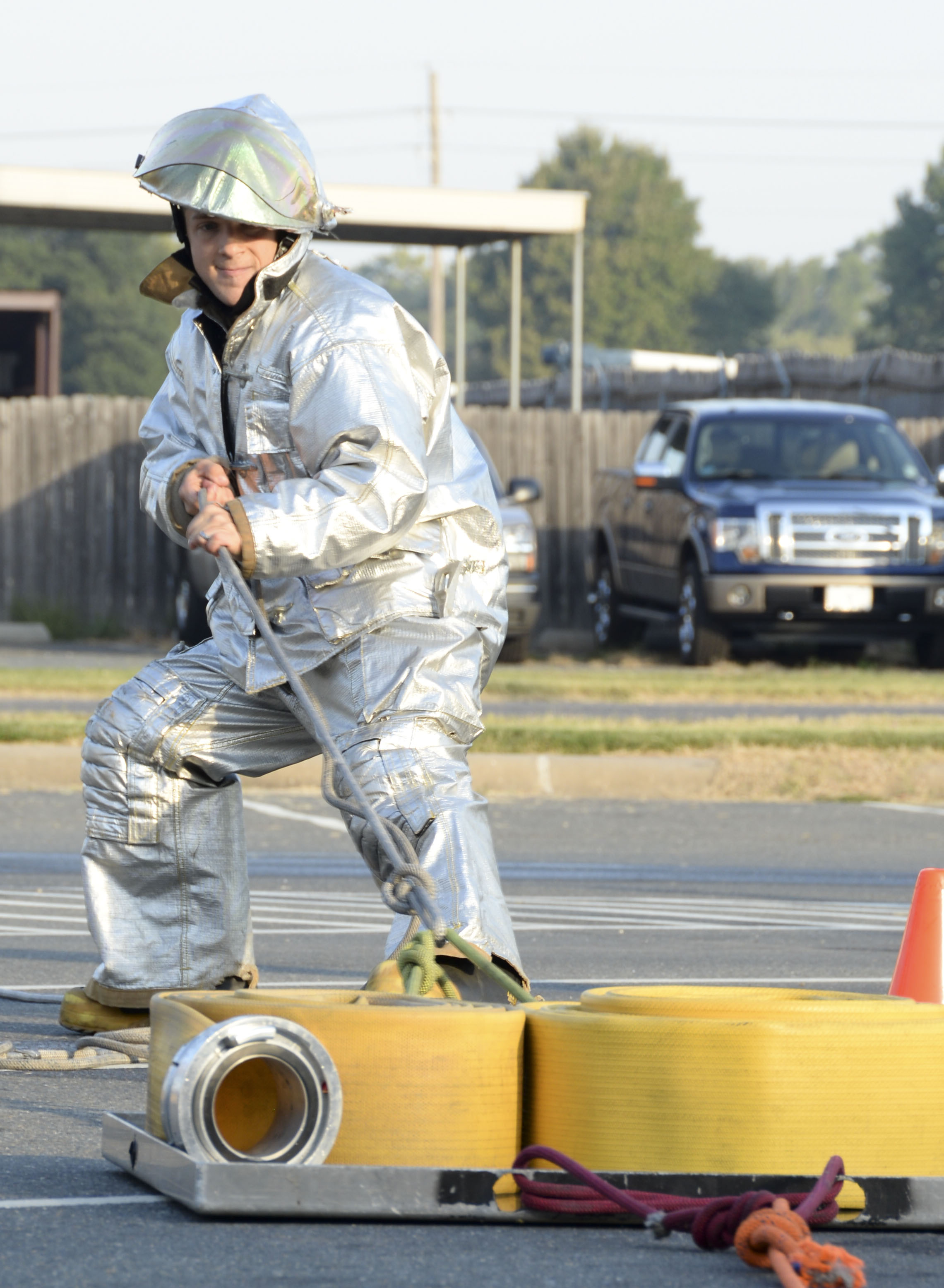 Competition burns red hot: Airmen do their best firefighter impersonations