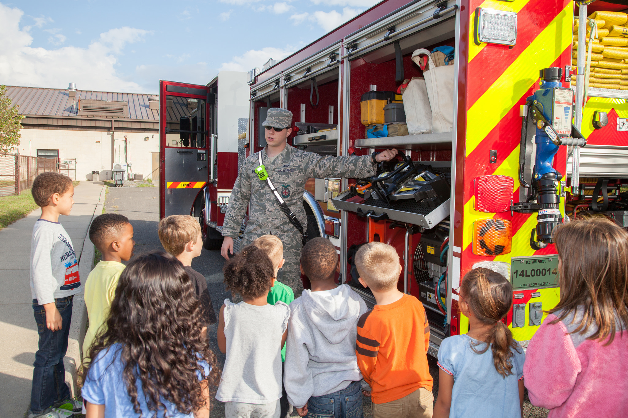 Firefighter teach base members about fire prevention