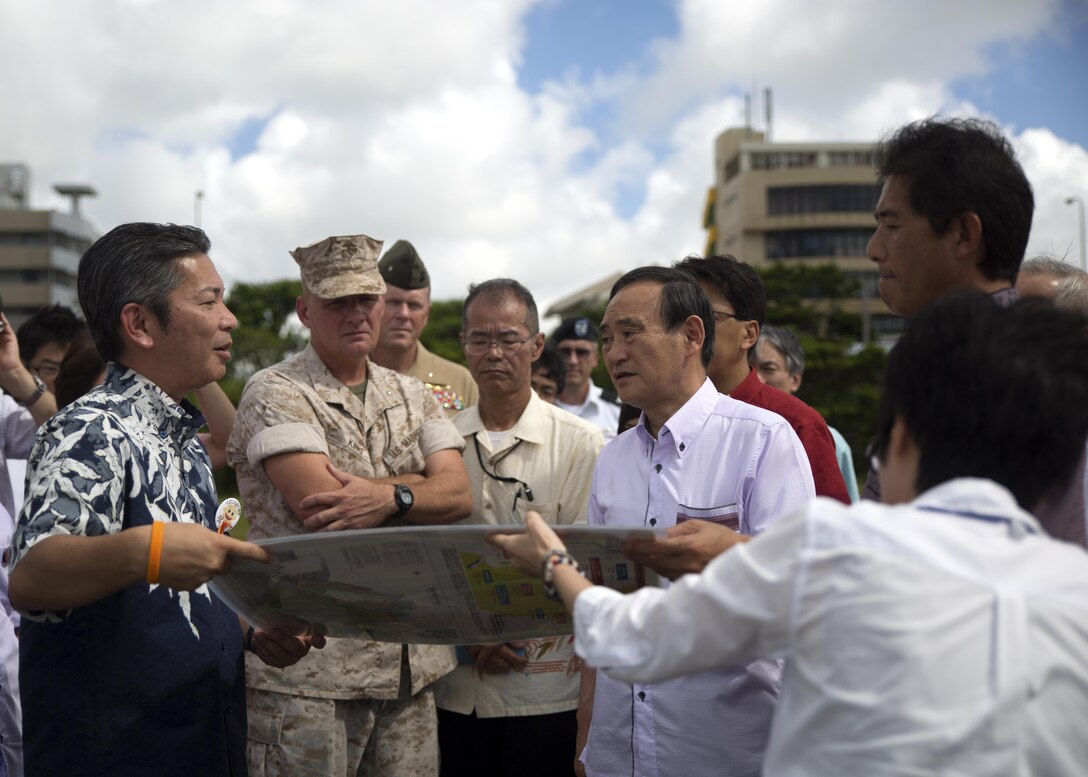 Japan Chief Cabinet Secretary visits Okinawa land return sites