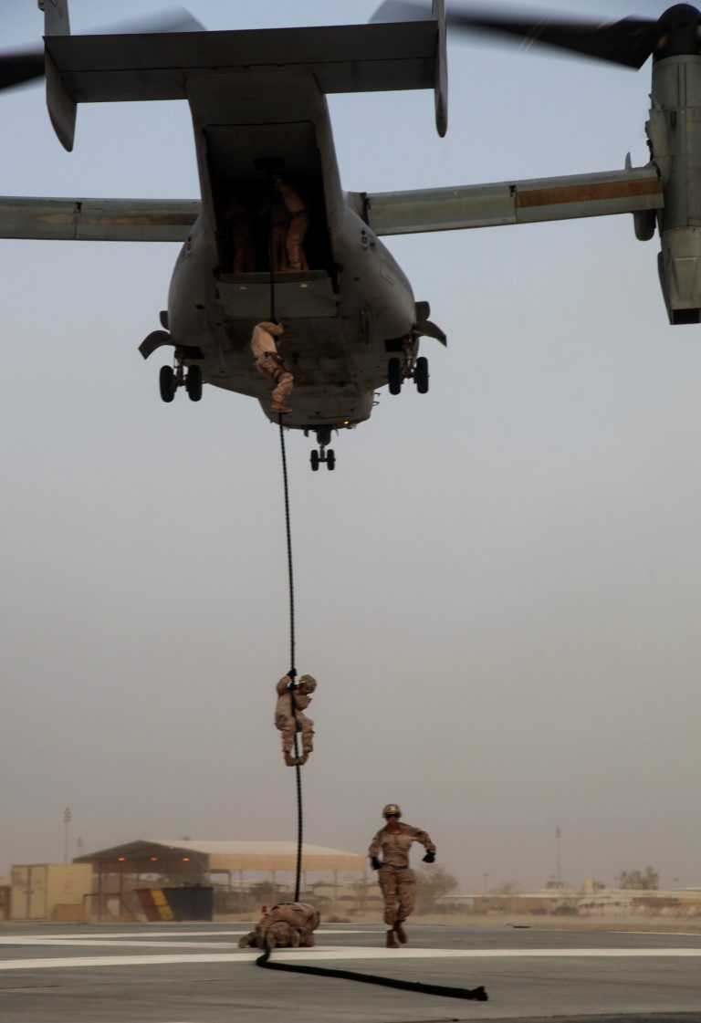 U.S. Marines fast rope from MV-22s in Southwest Asia