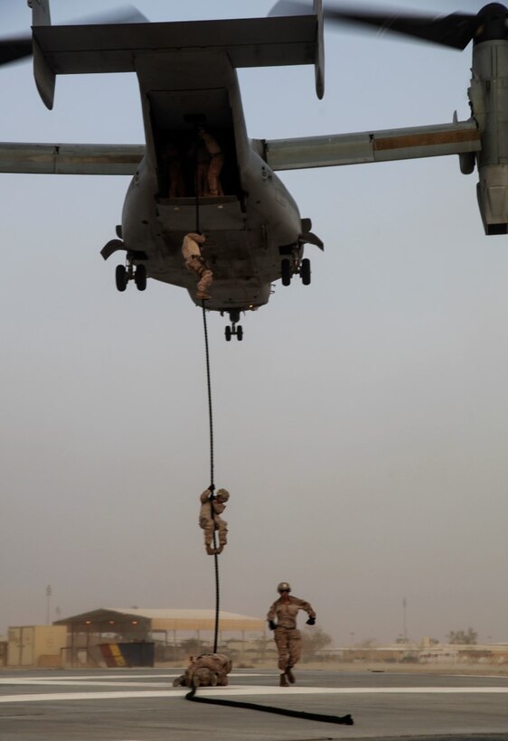 U.S. Marines fast rope from MV-22s in Southwest Asia