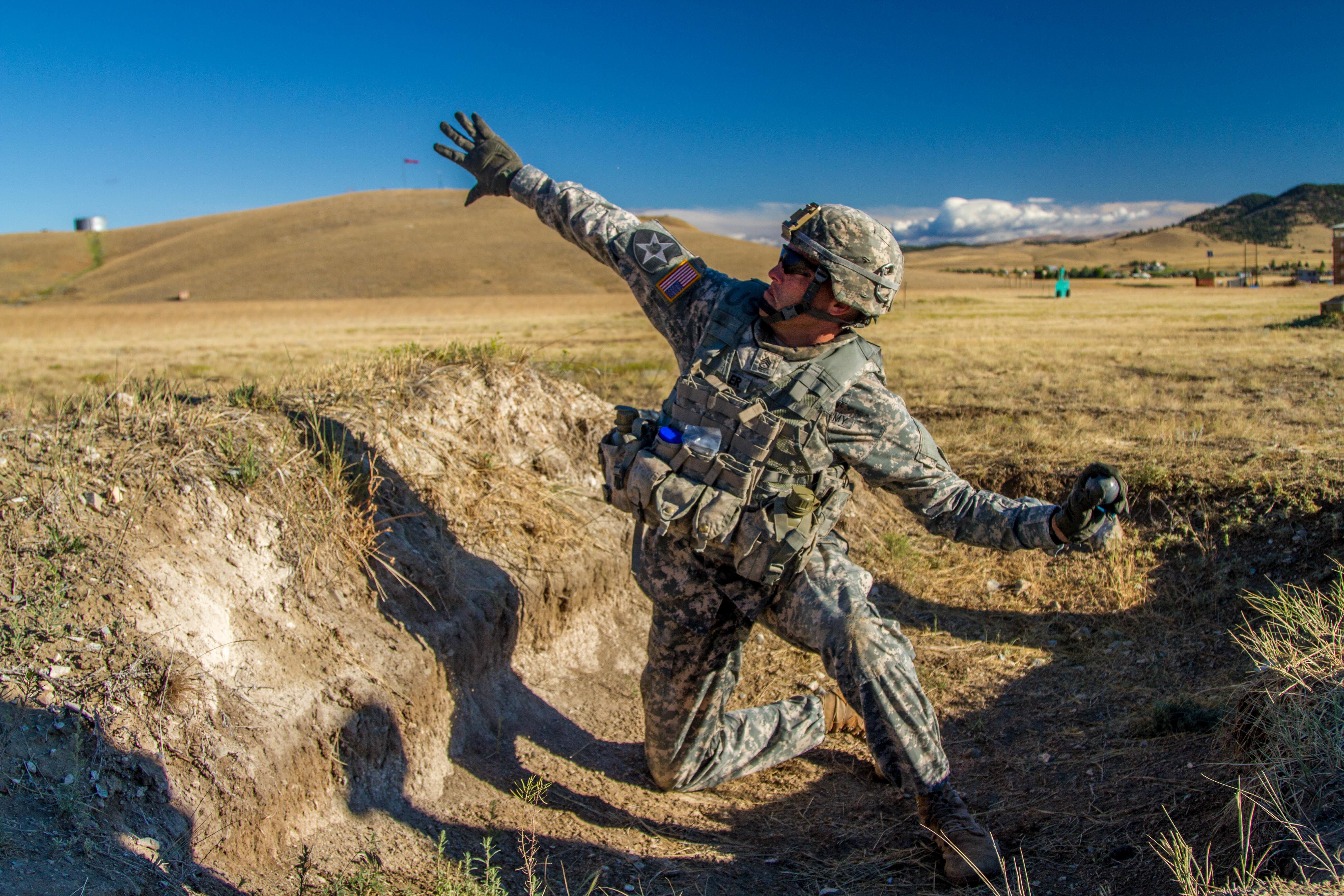 Sgt. 1st Class Joshua Moeller throws grenade