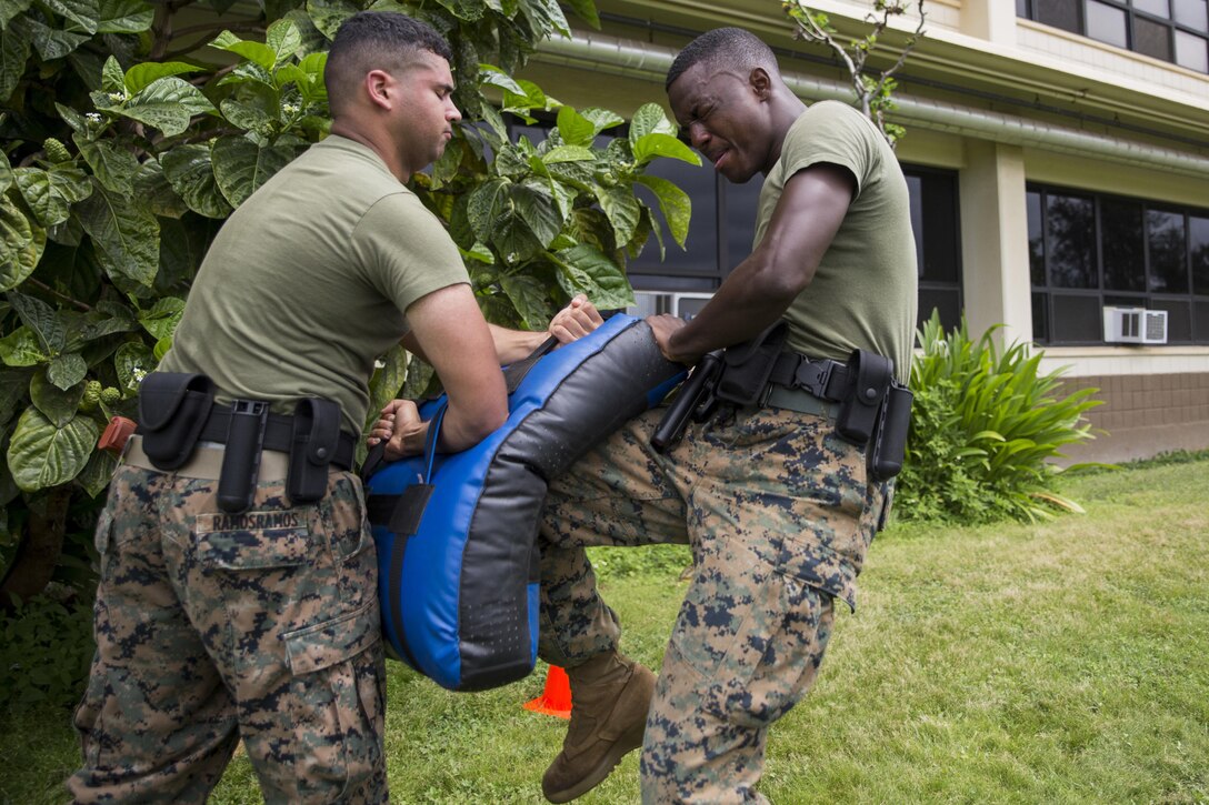 Marines shed tears, fight through pepper spray