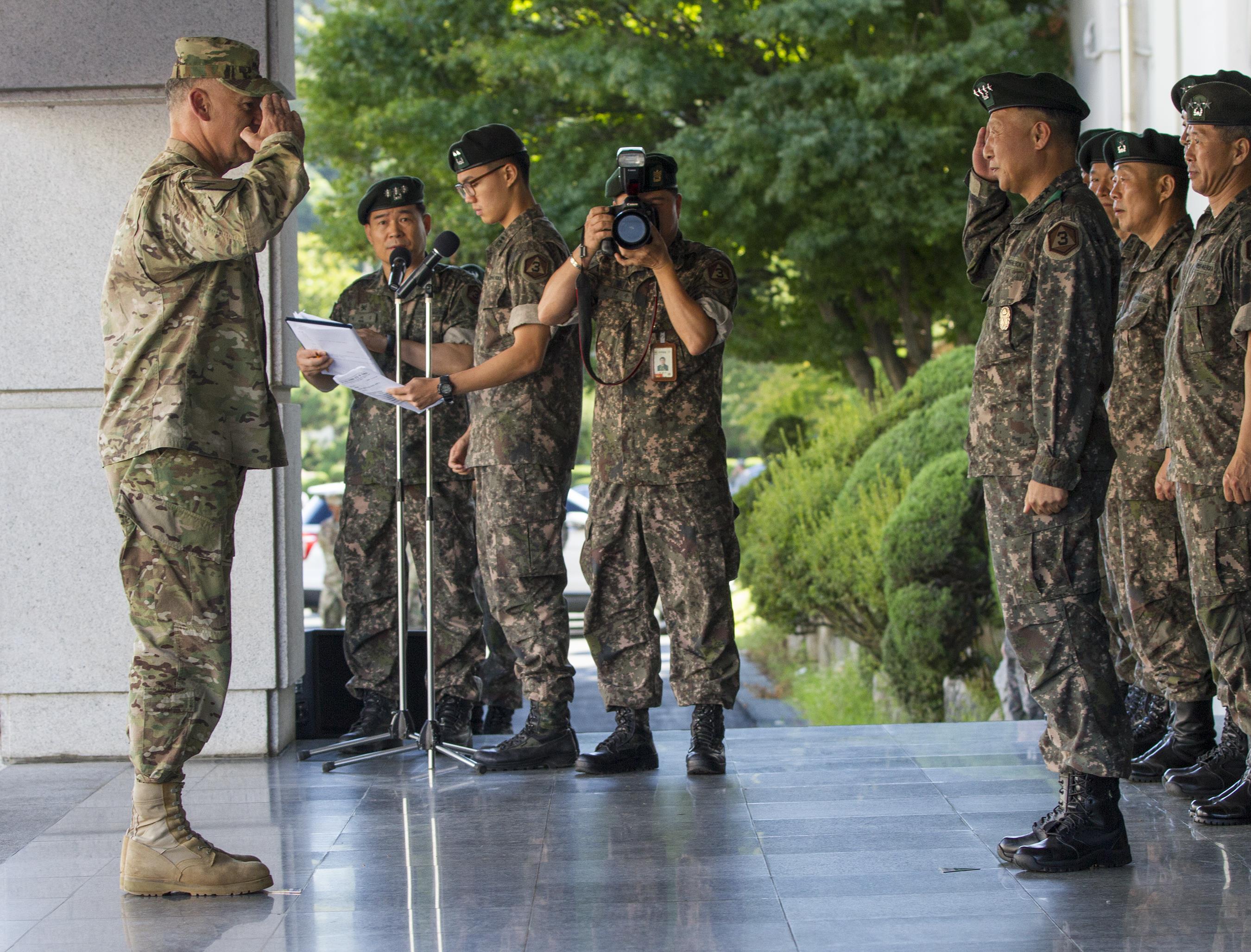 General salutes general