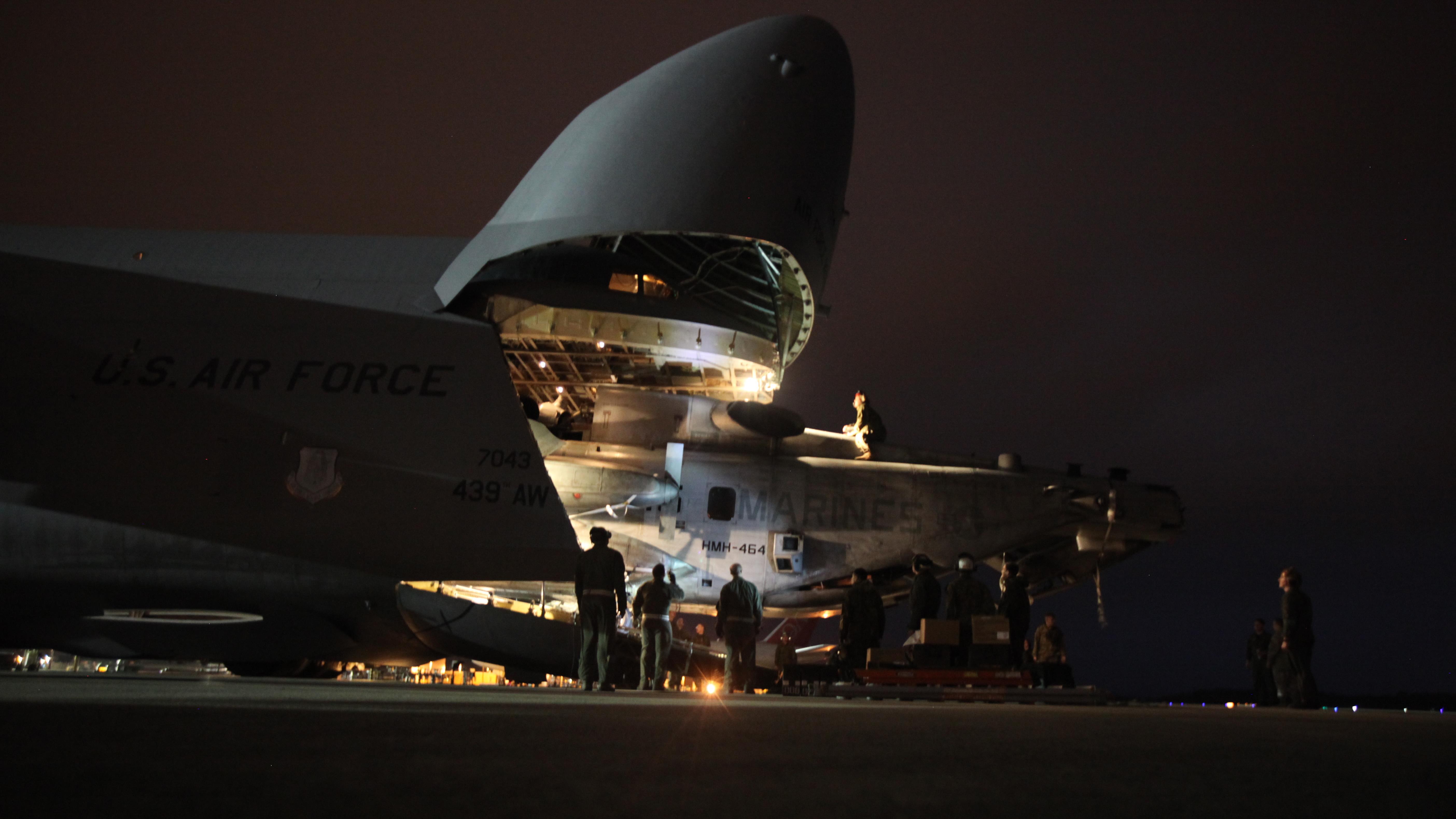 Marines with HMH-464 load CH-53Es in preparation for Operation Cold ...