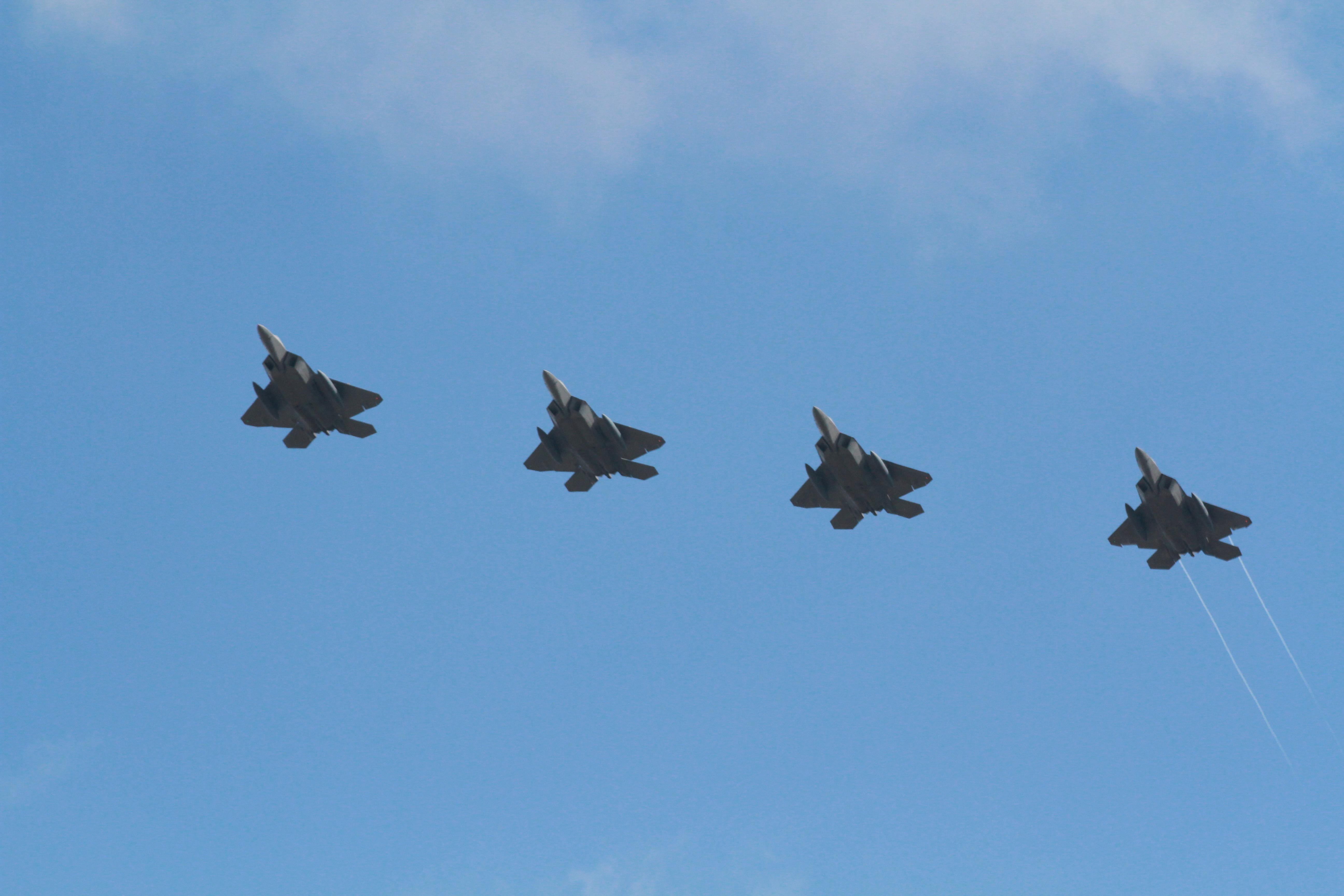 Four United States Air Force F-22 “Raptor” fighter aircraft fly over ...