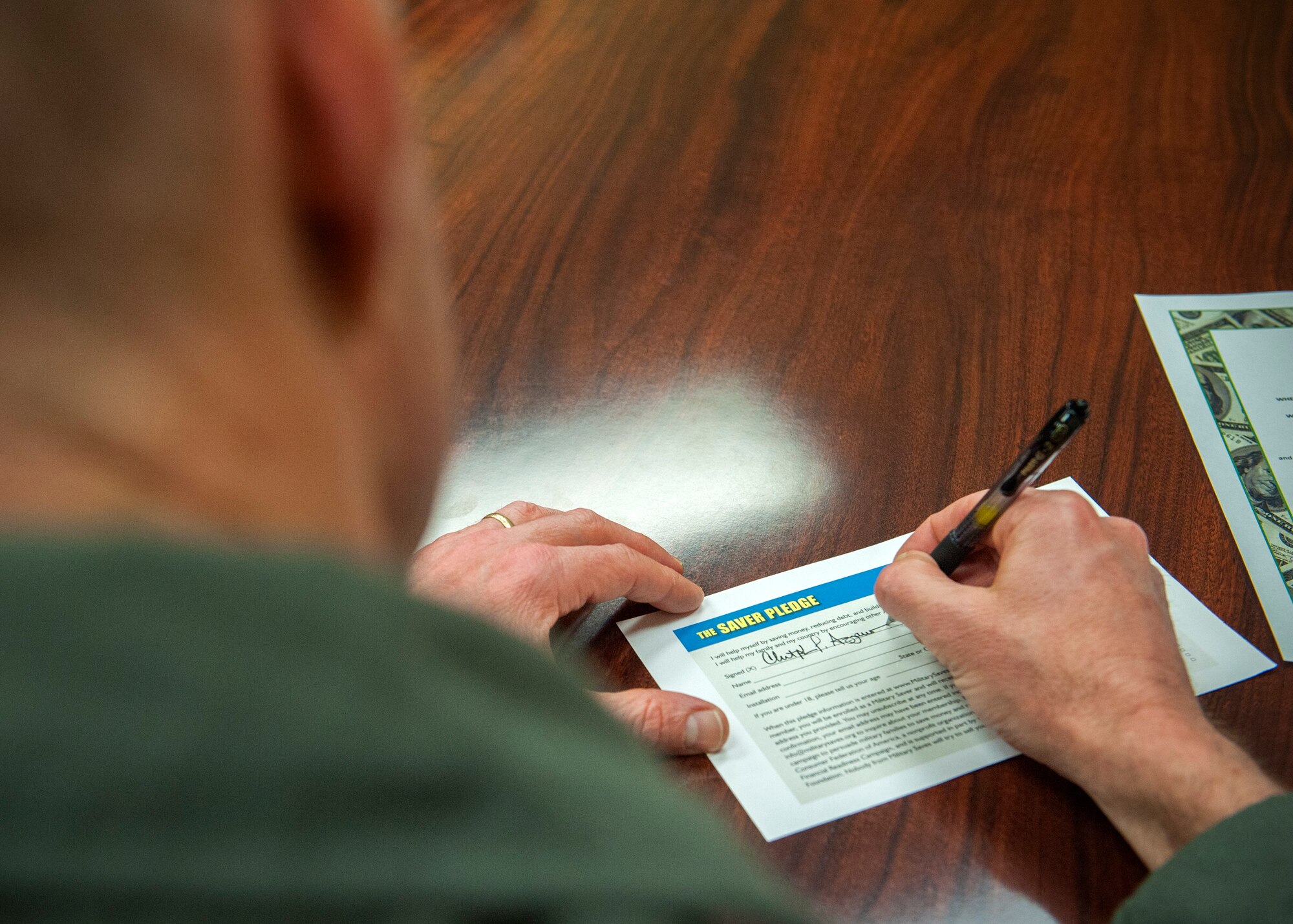 Wing CC first to sign "Military Saves" pledge card > Eglin Air Force ...