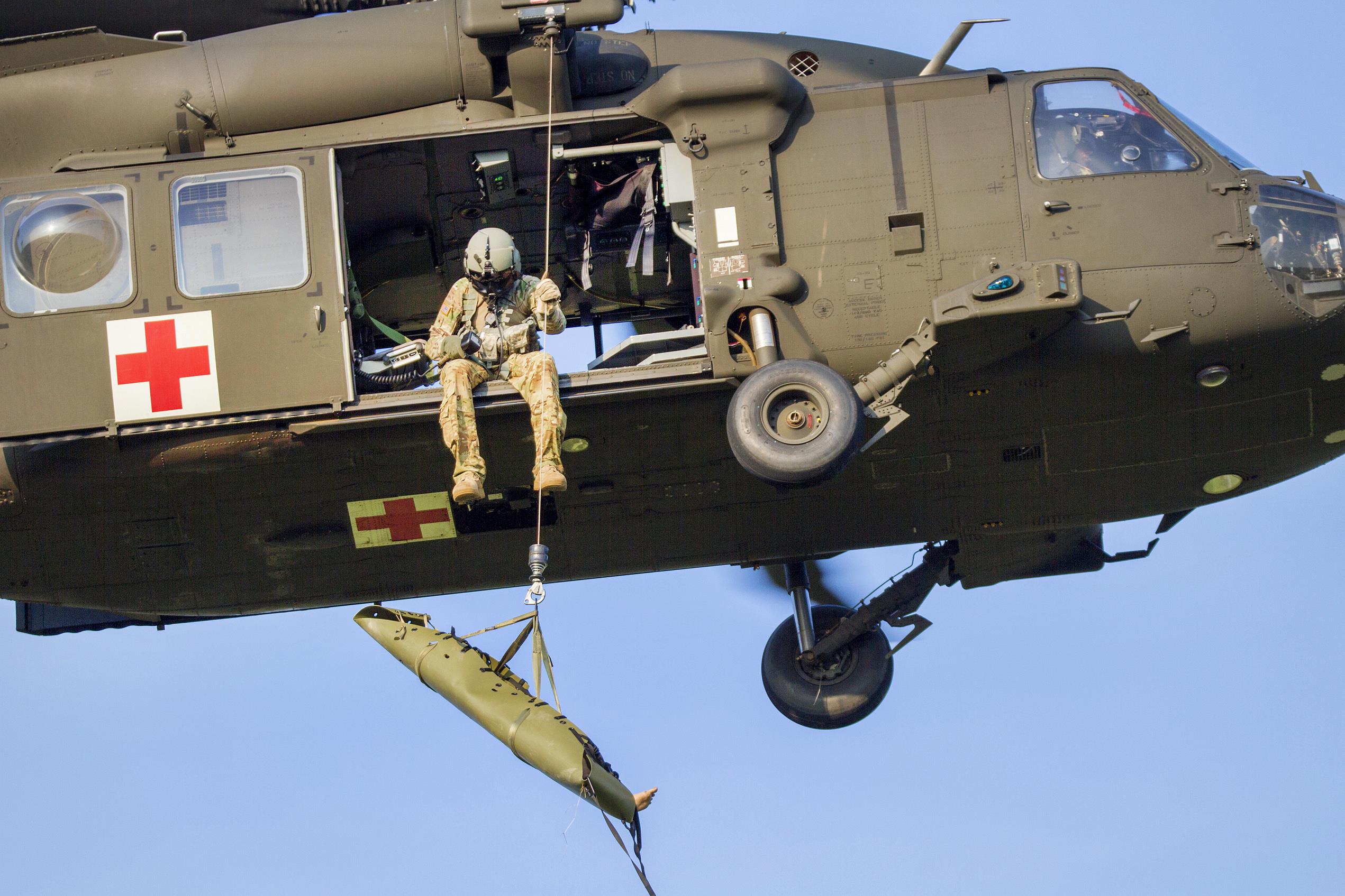 Hoisting A Stretcher | U.S. Department of War