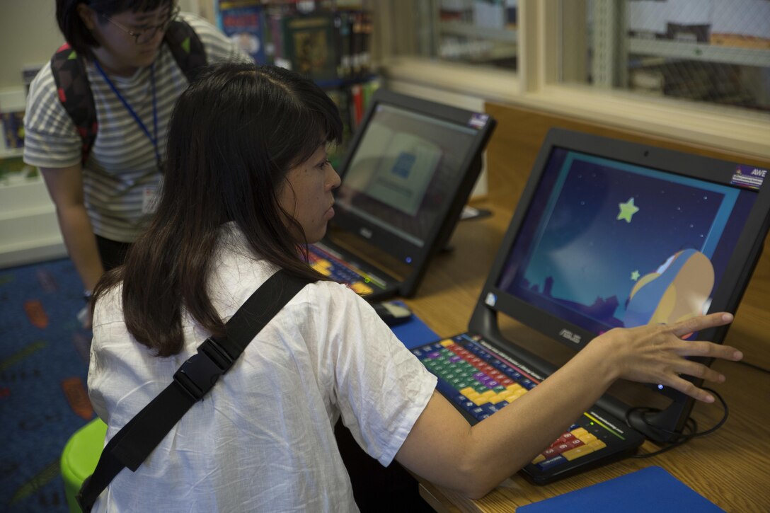 Okinawan librarians visit, exchange at Camp Foster library