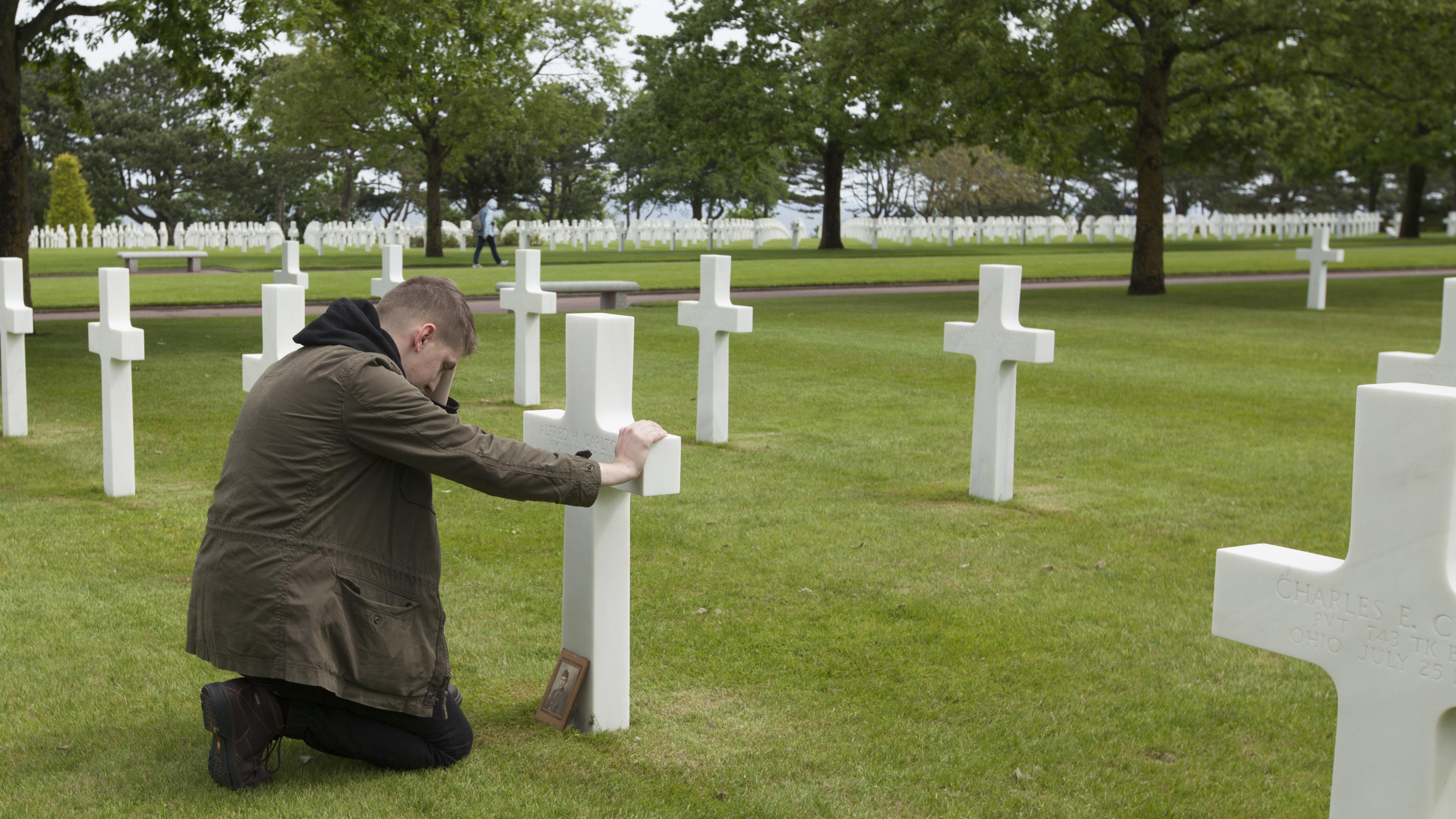 Marine visits gravesite of WWII family hero