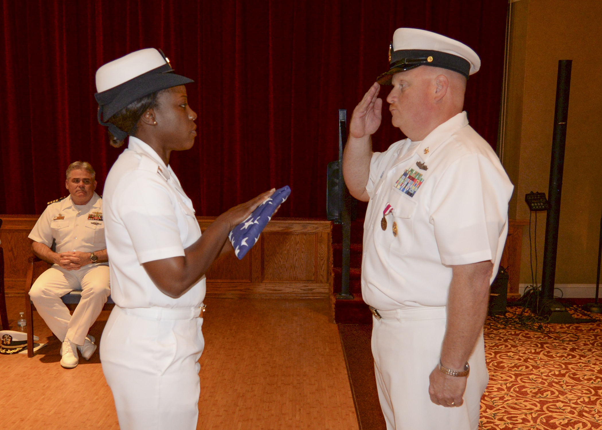 CMC Gardner receives flag during retirement ceremony