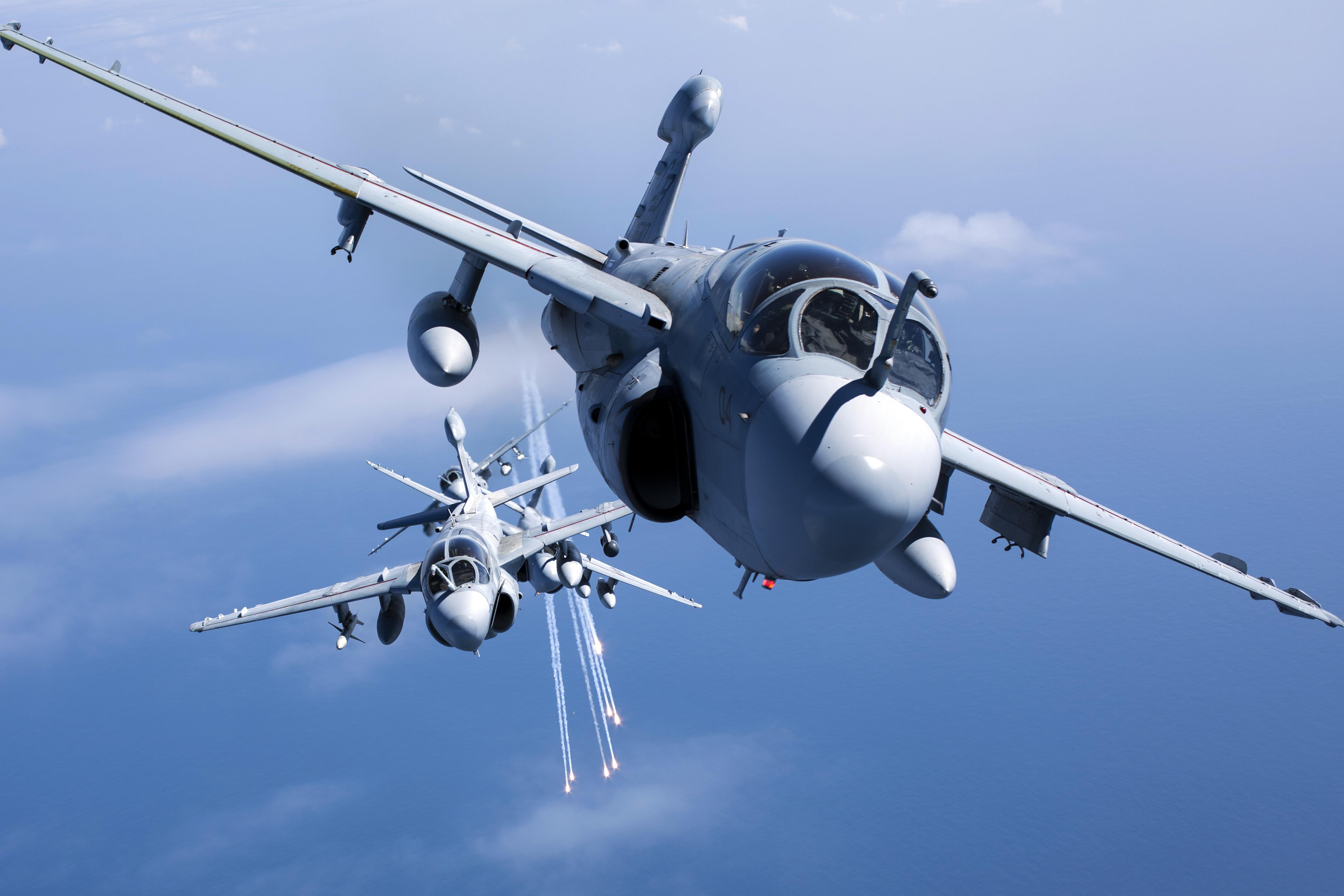 Four EA-6B Prowler aircraft conduct an aerial refuel and formation ...