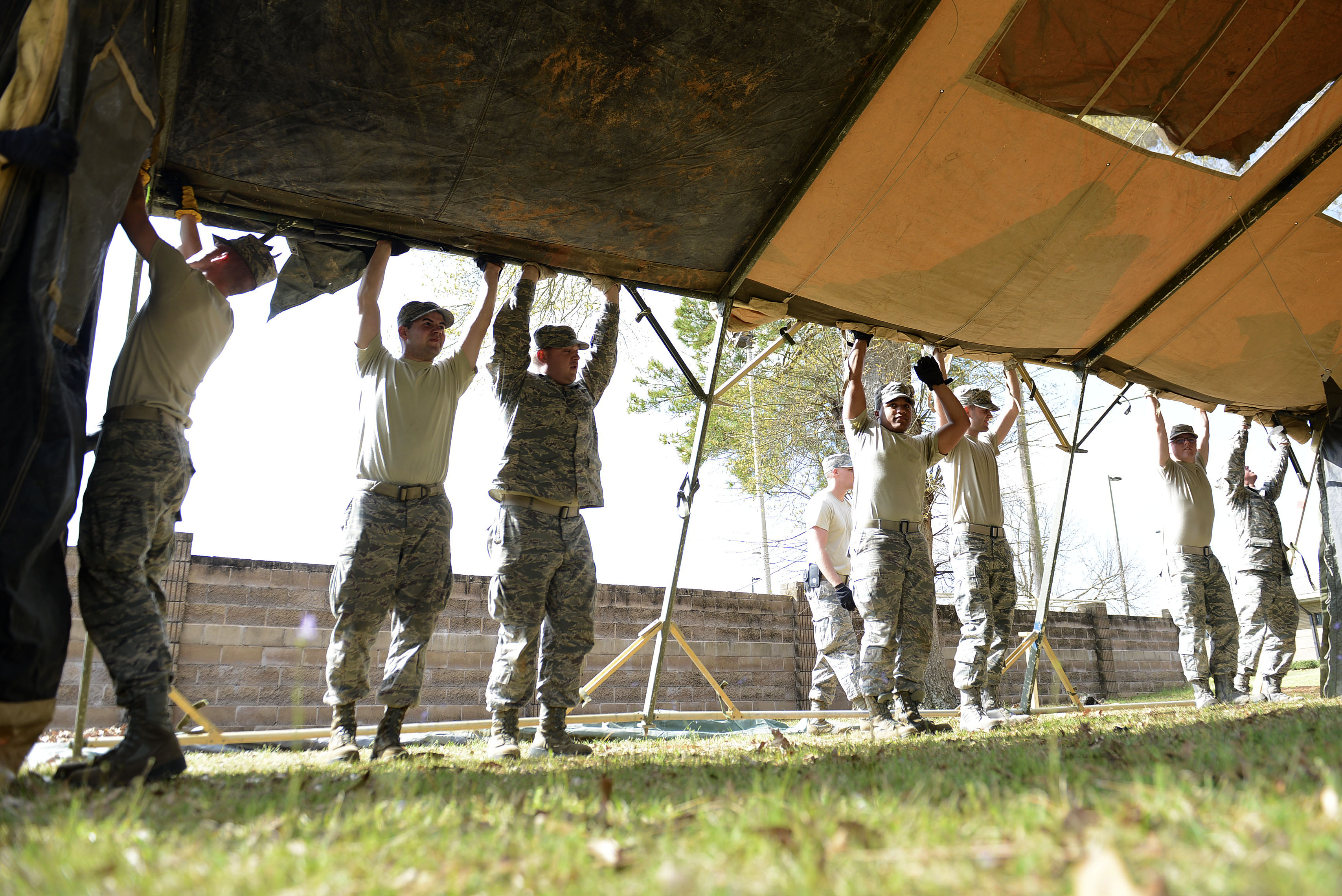 Firefighters prepare tents for training