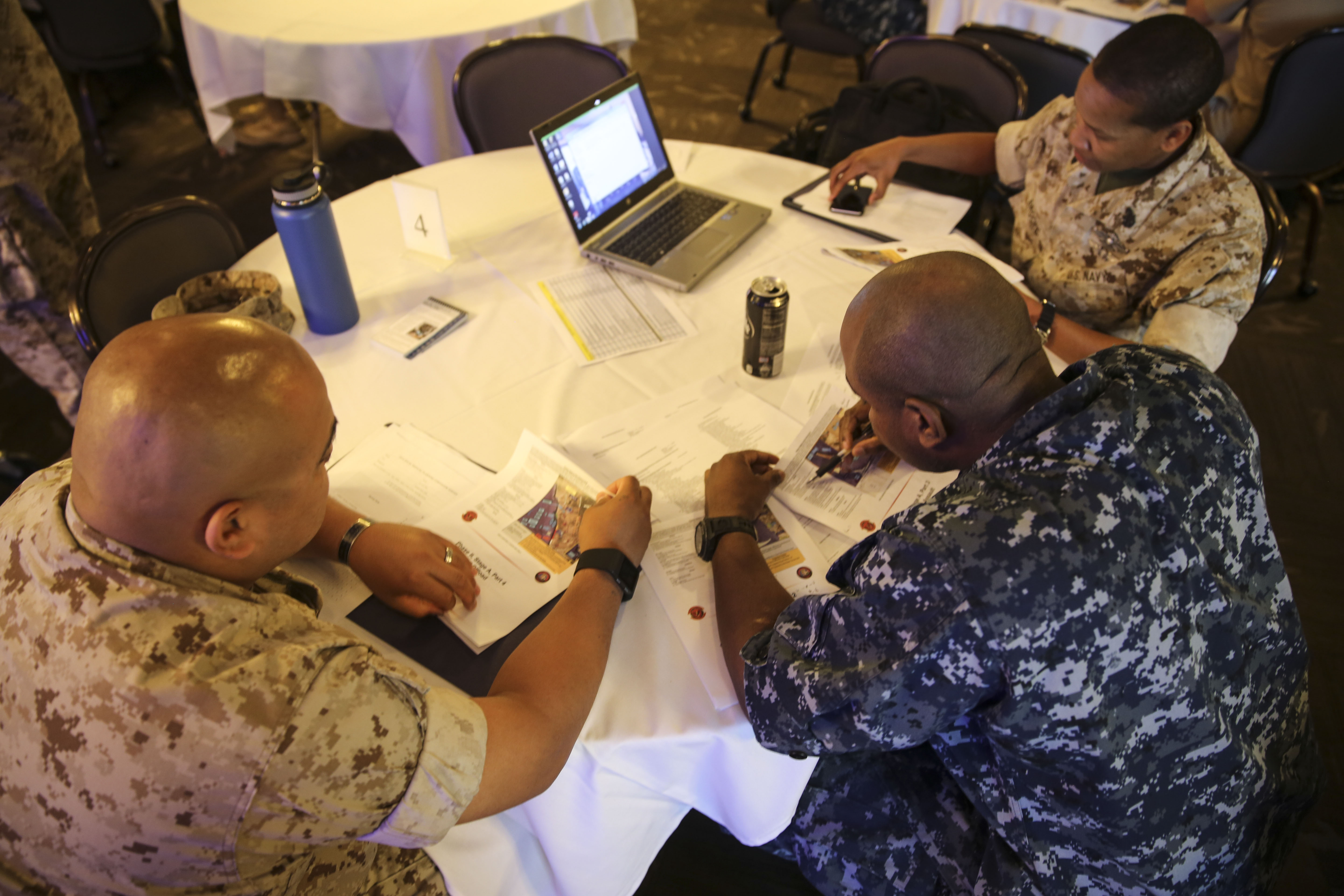 Medical officers learn vital skills during planning symposium aboard ...