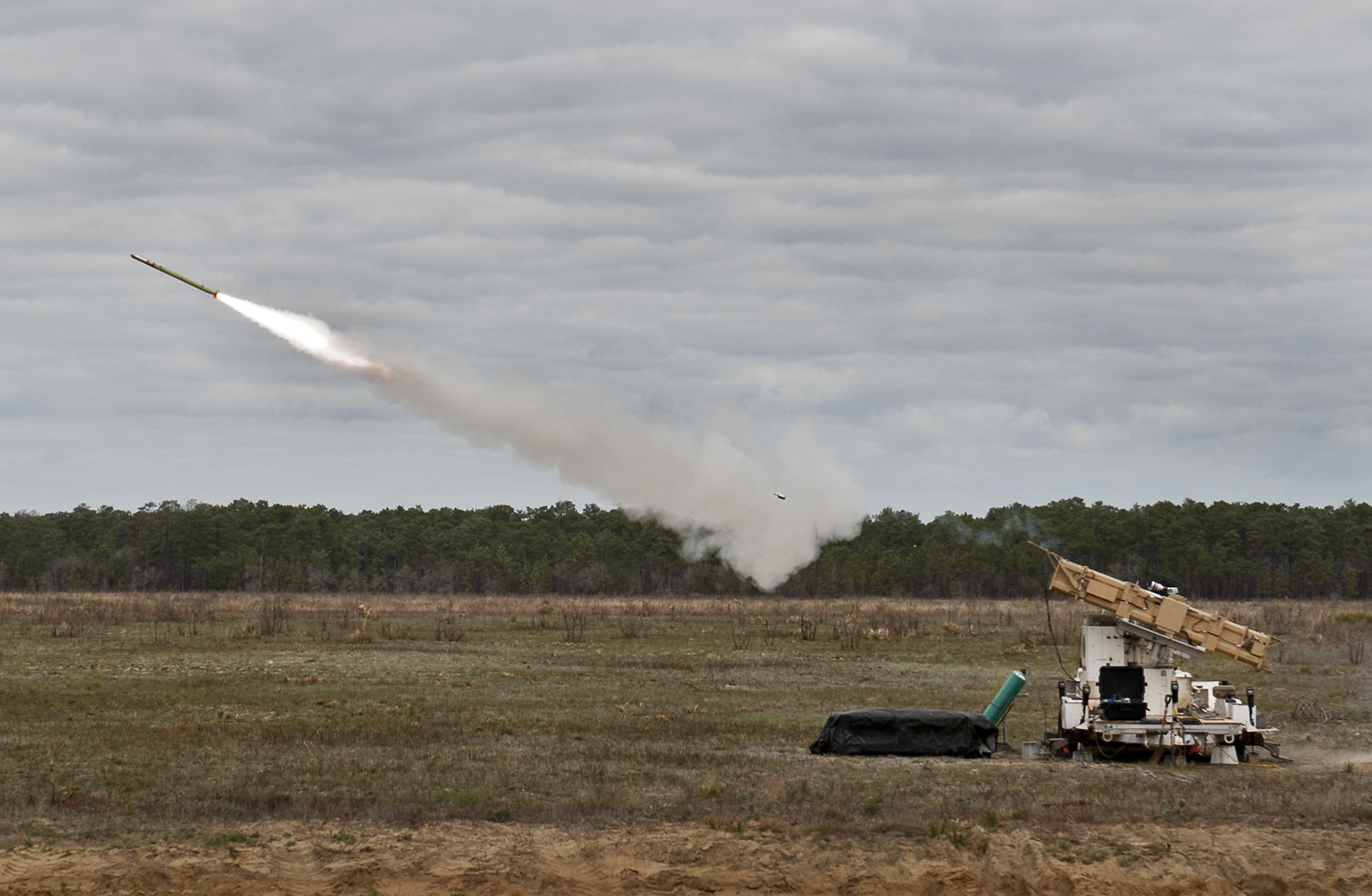 An FIM-92 Stinger missile is fired downrange from the Army's new multi ...