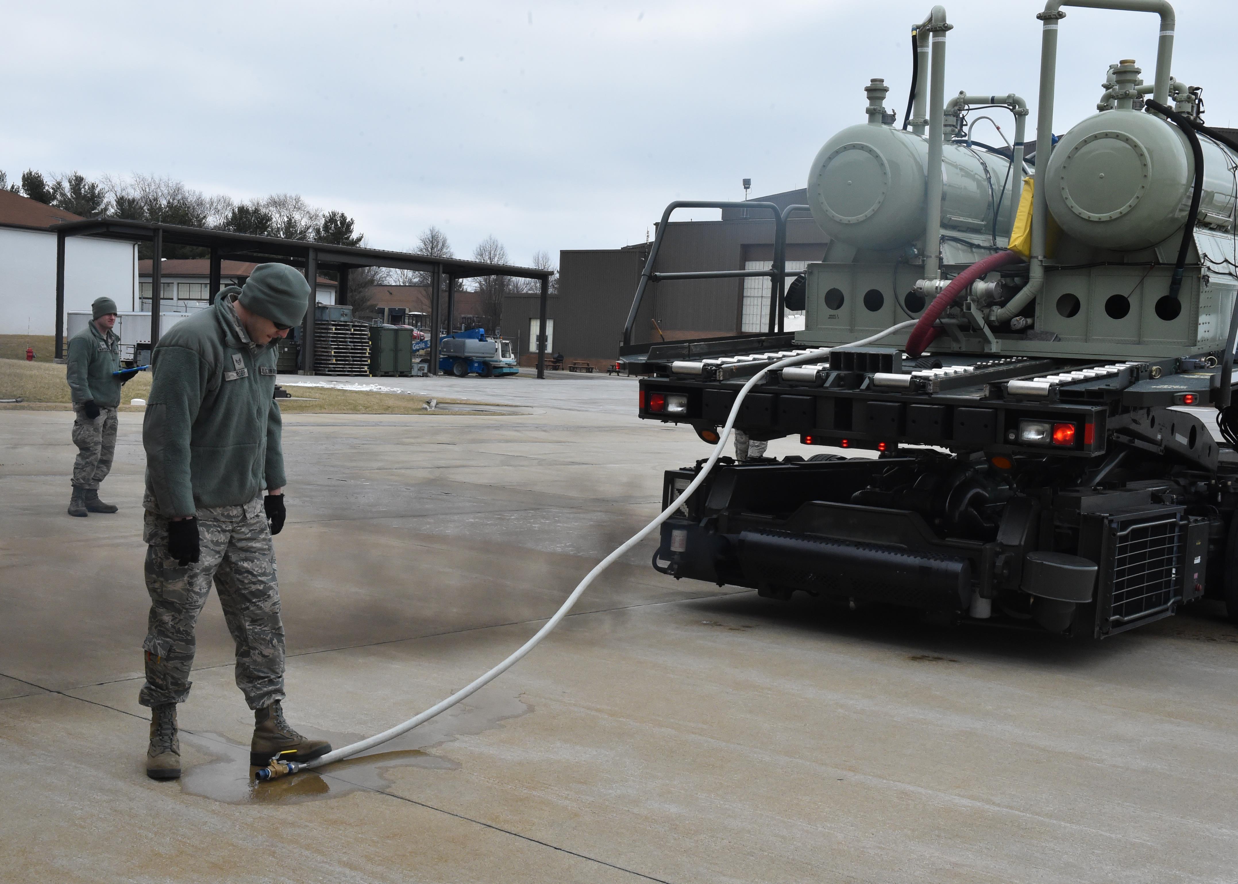 Airmen at Work: Spray maintainers prep MASS for mission